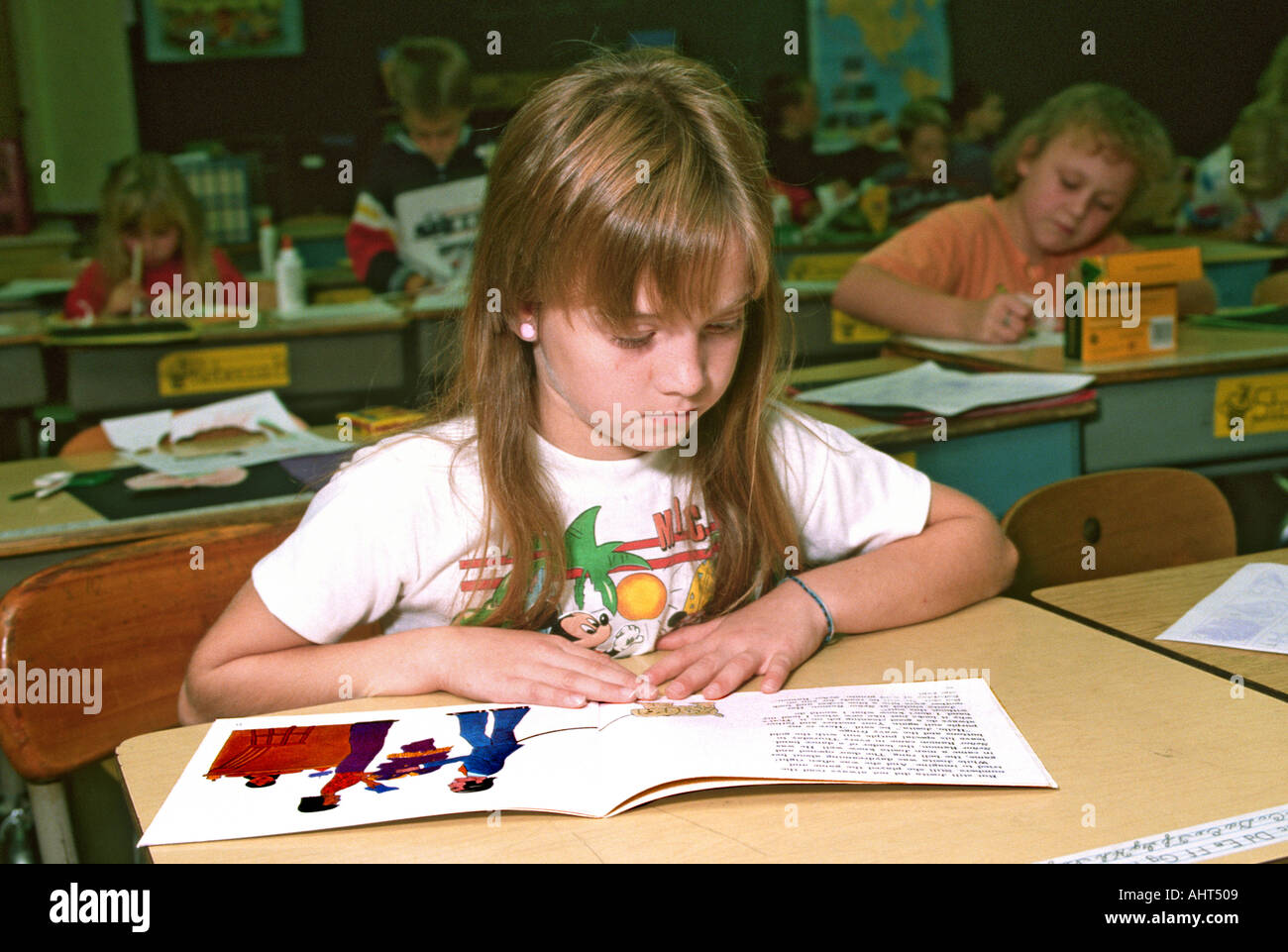 3rd Grade female studies reading skills Stock Photo - Alamy