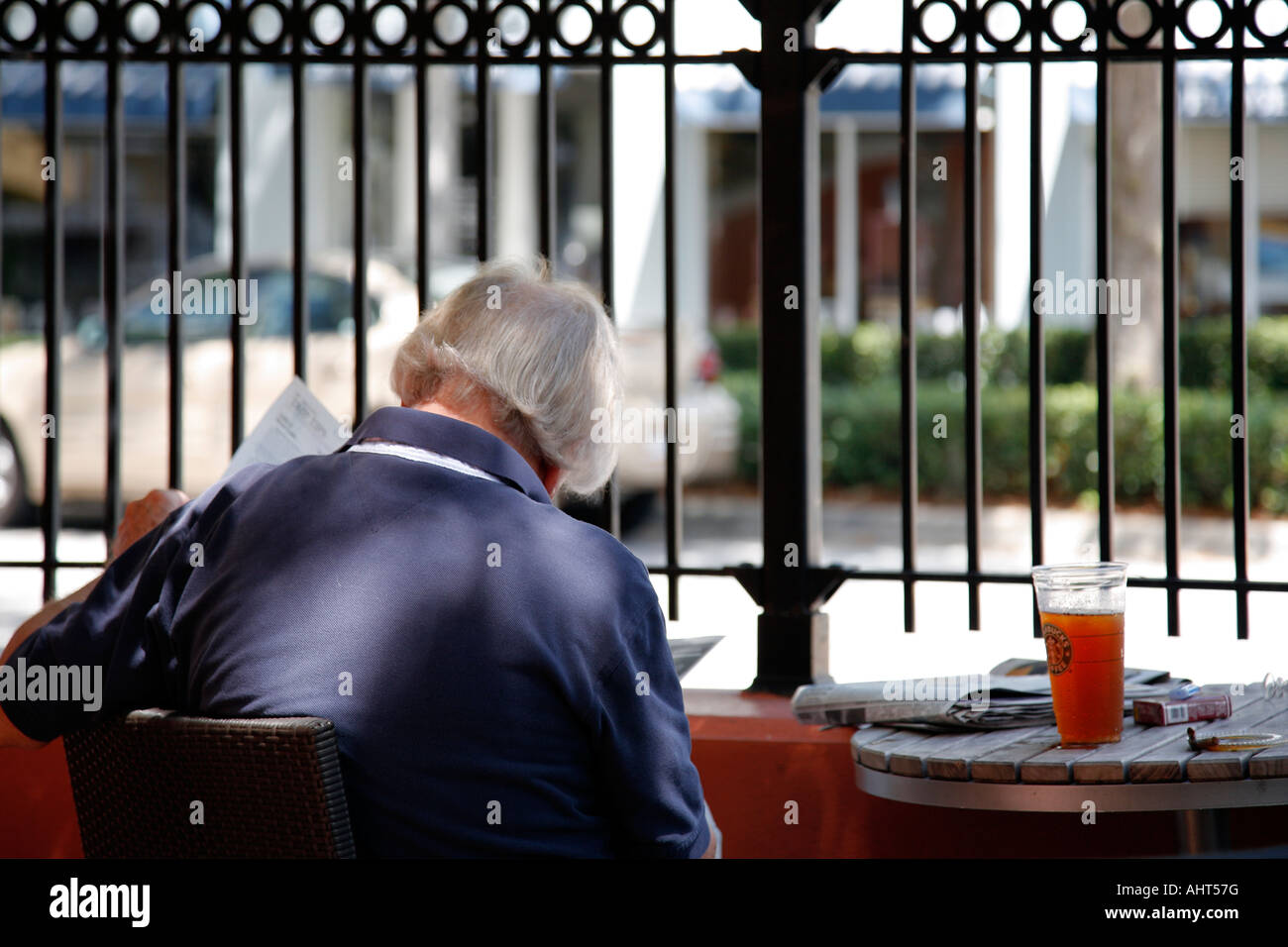 Woman reading newspaper on terrace hi-res stock photography and images ...
