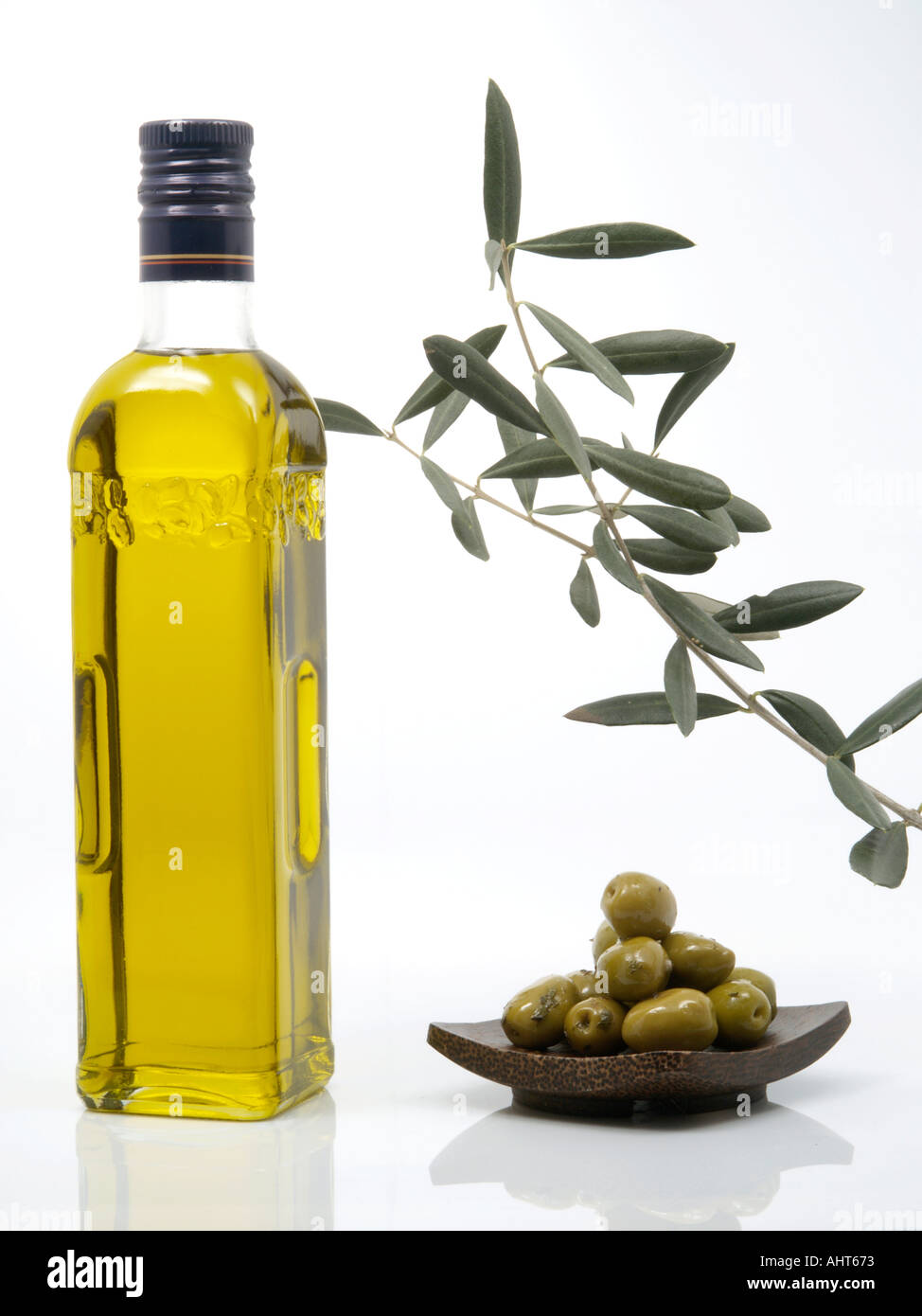 Olive bottle with olives and an olive tree branch Stock Photo - Alamy