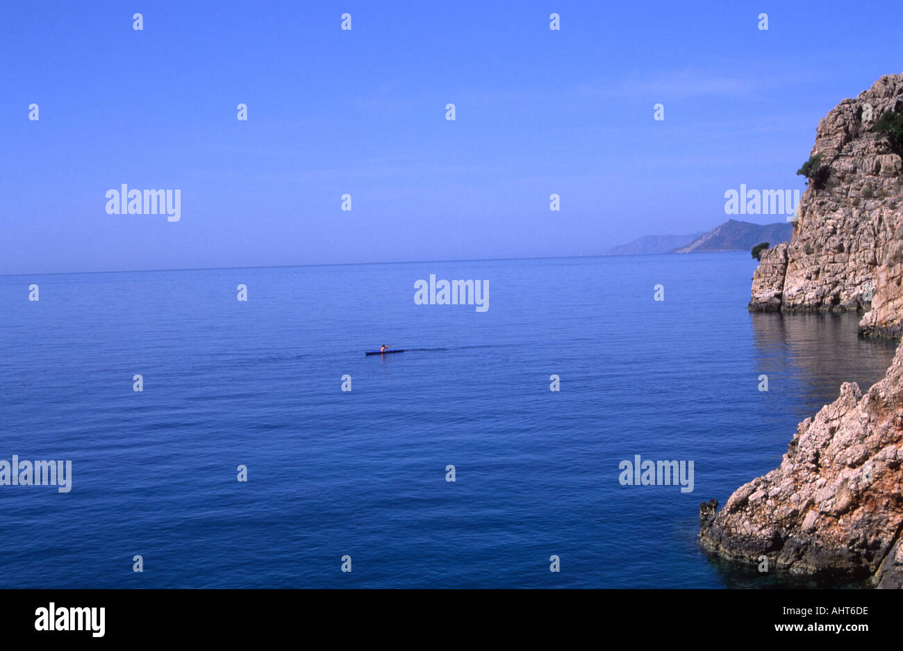 Limestone cliffs and blue sea Turkey person canoeing Stock Photo - Alamy