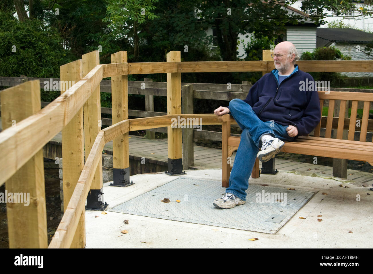 Man sitting on a bench Stock Photo - Alamy