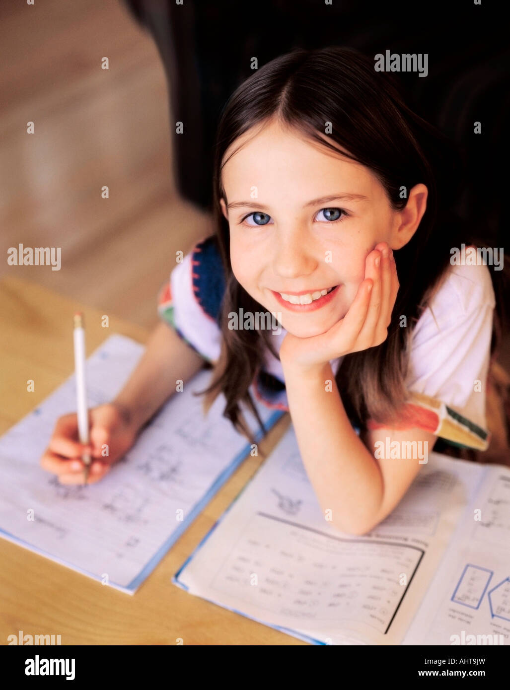 Little girl happy to do homework Stock Photo - Alamy