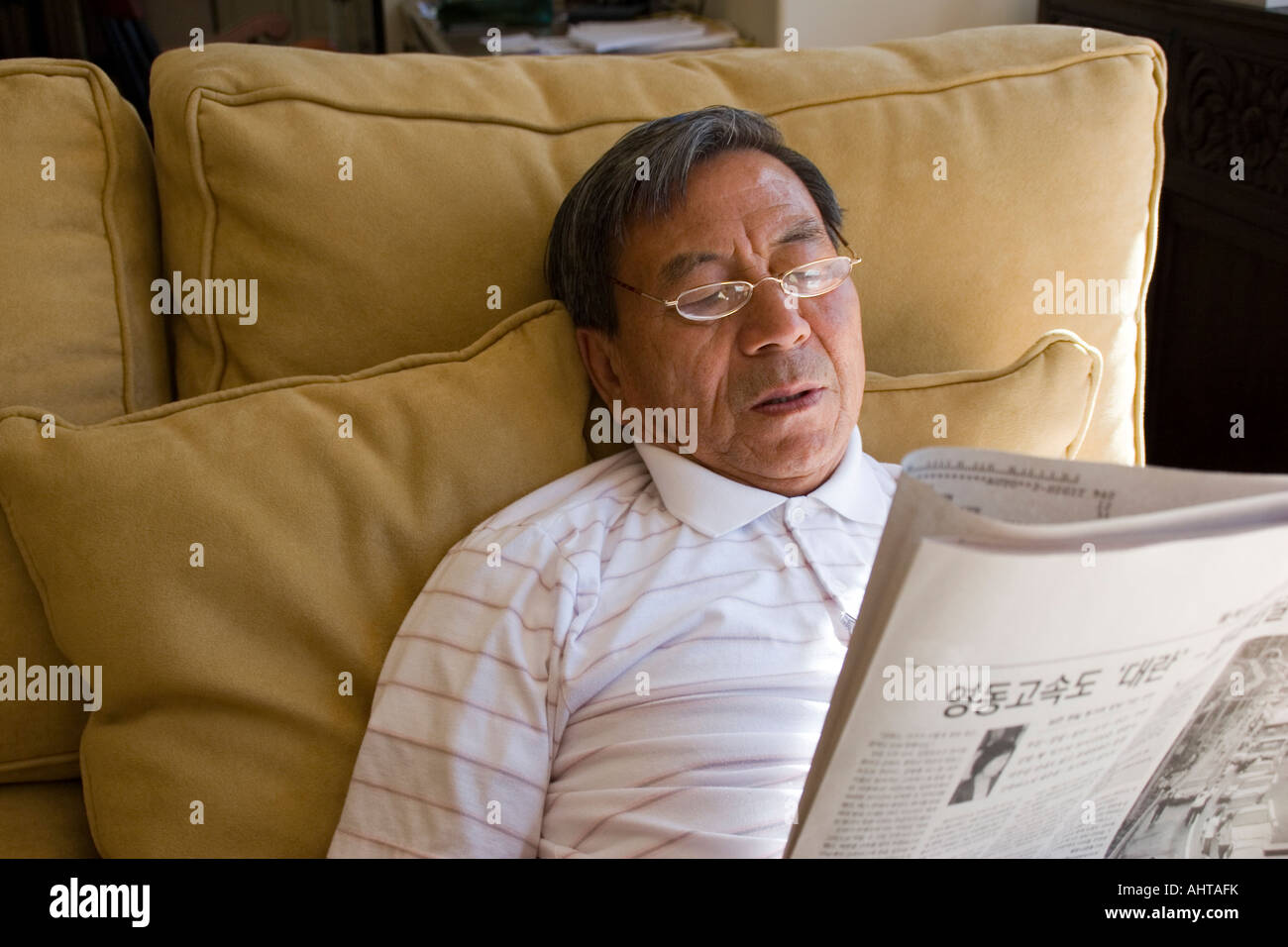 Senior Man Reading Paper Stock Photo - Alamy
