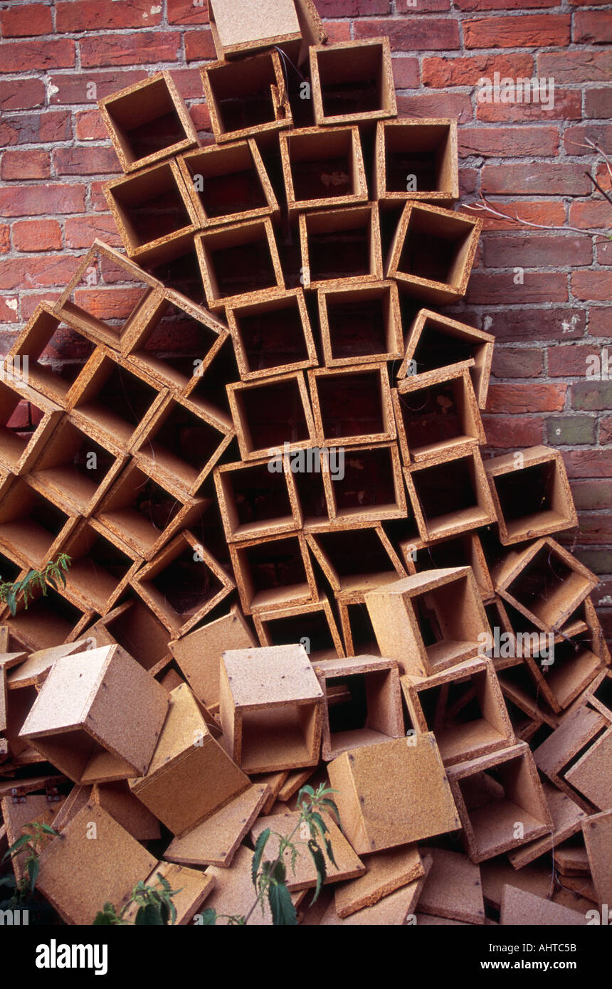 Pile of wooden boxes against red brick wall Stock Photo - Alamy