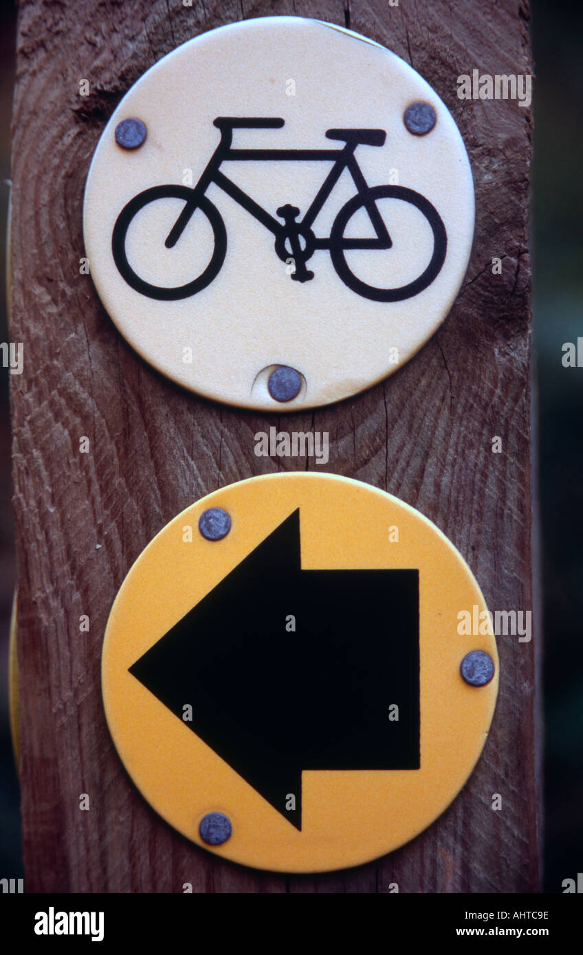 White circular cycle route sign yellow circular direction arrow on ...