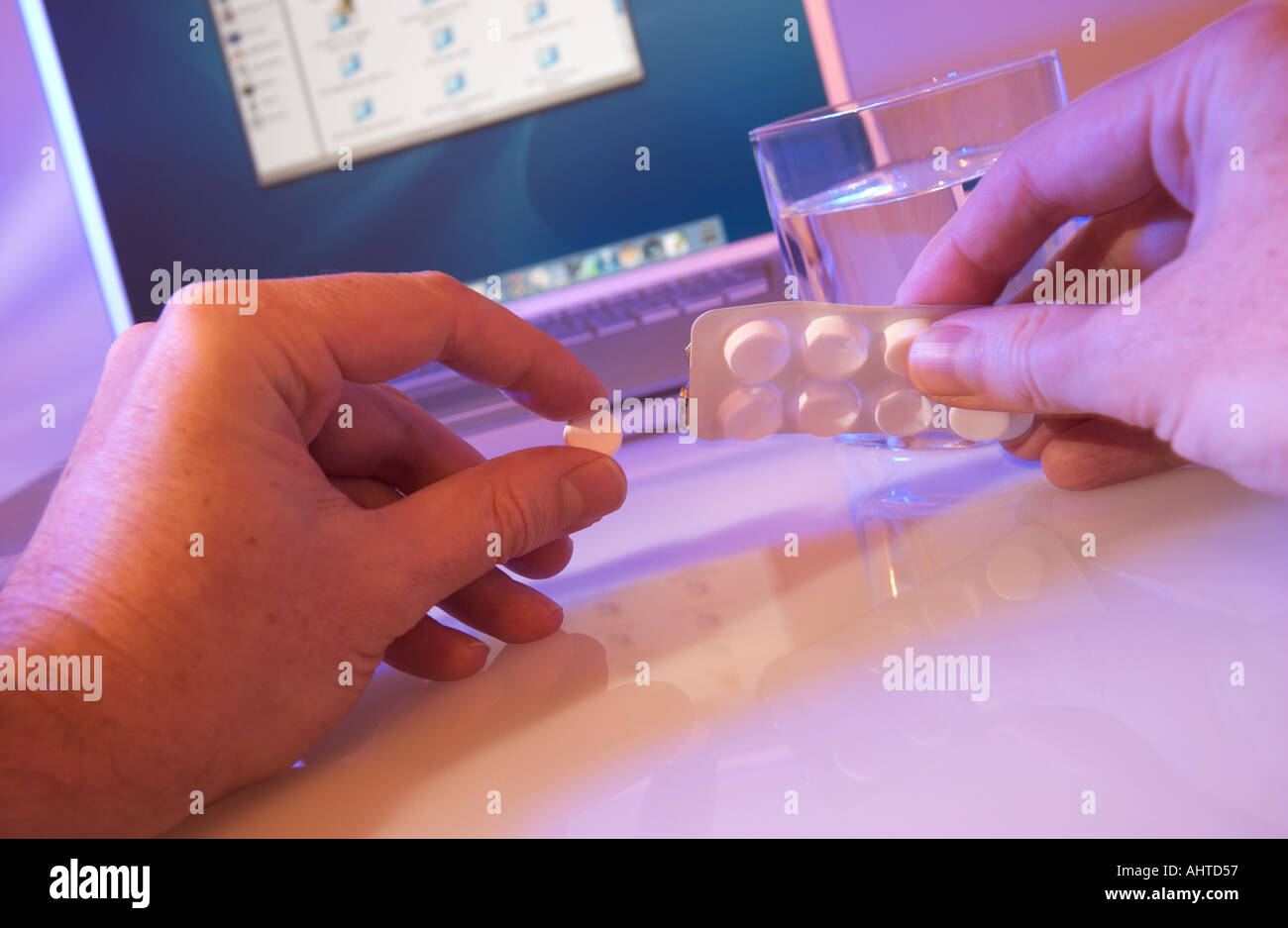 computer and hands getting medication Stock Photo - Alamy