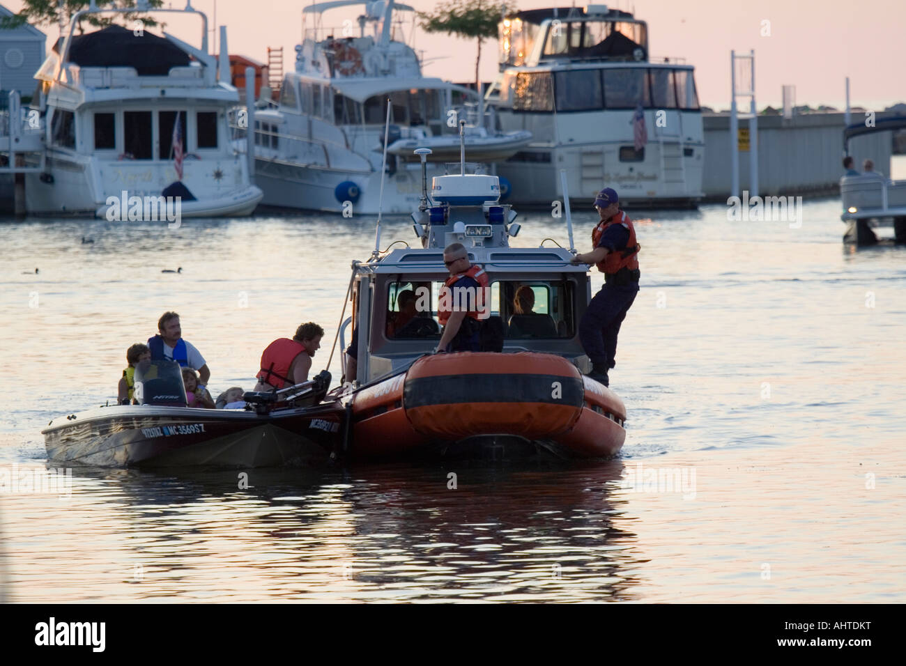 Coast Guard patrol directing boat traffic in harbor Stock Photo - Alamy