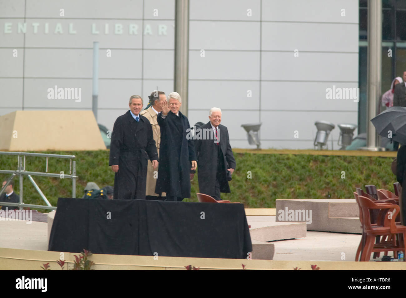 Former U S President Bill Clinton waves from the stage accompanied by ...