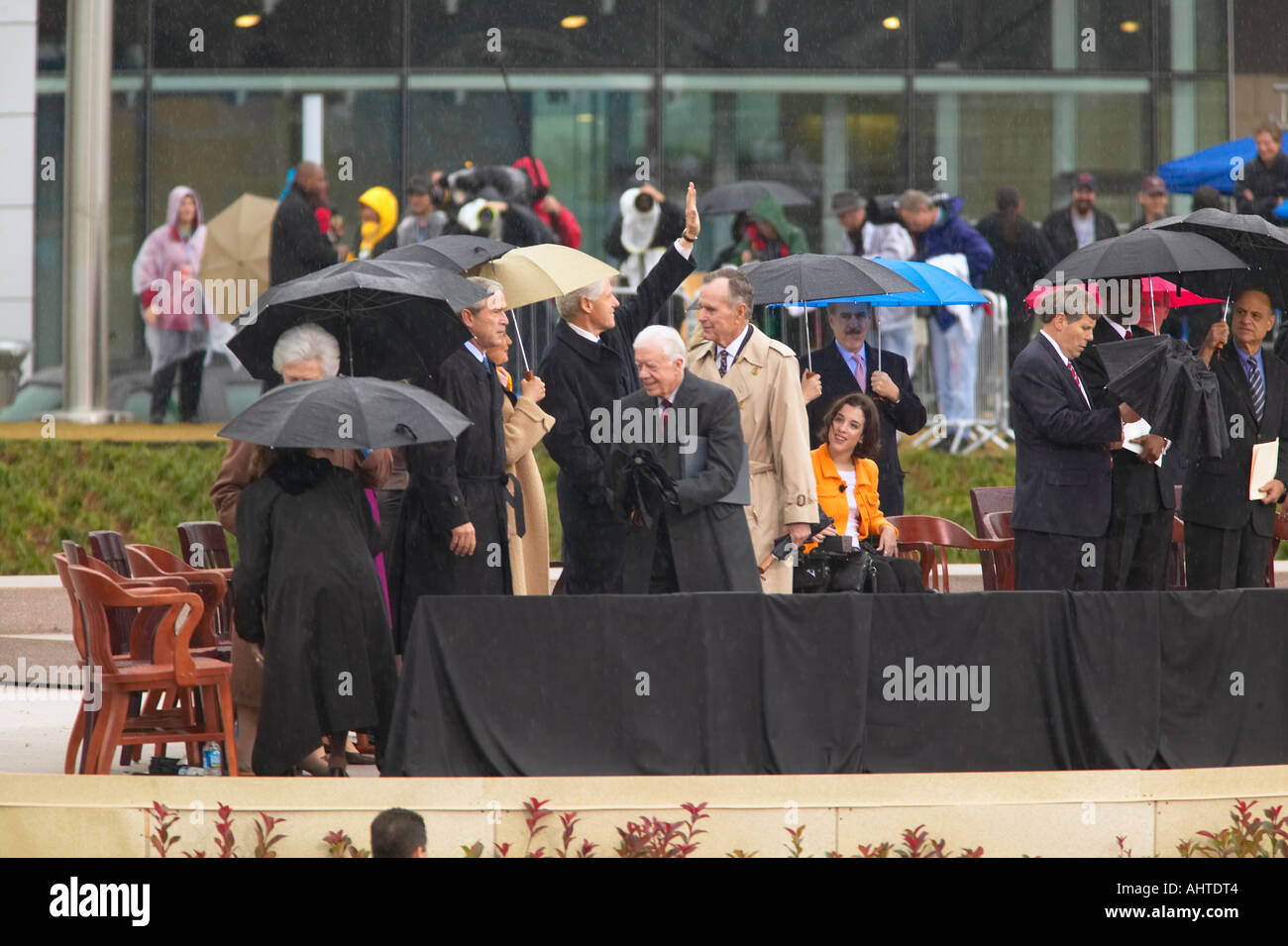 Former U S President Bill Clinton waves from the stage accompanied by ...