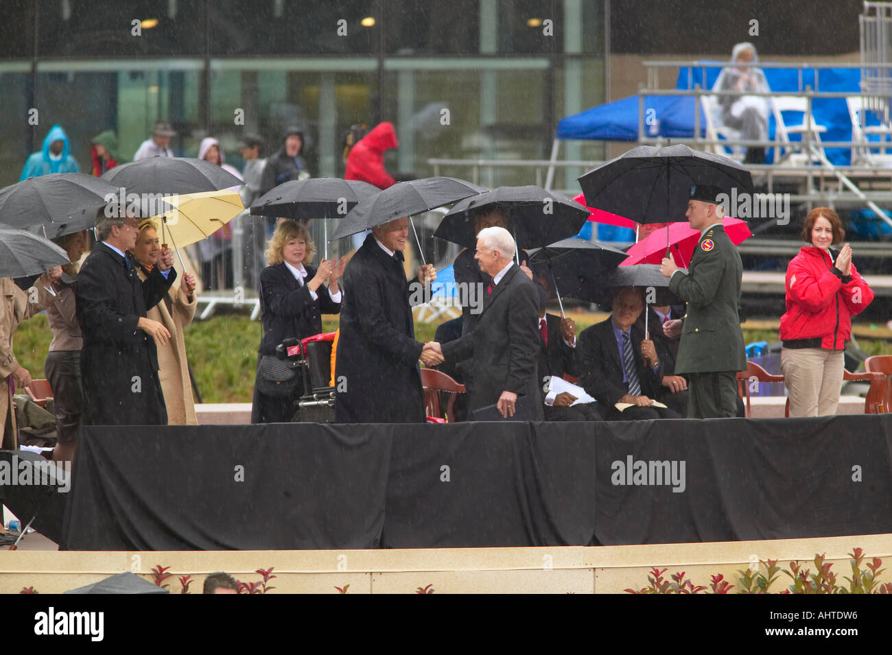Former US President Jimmy Carter shakes hands with former US President ...