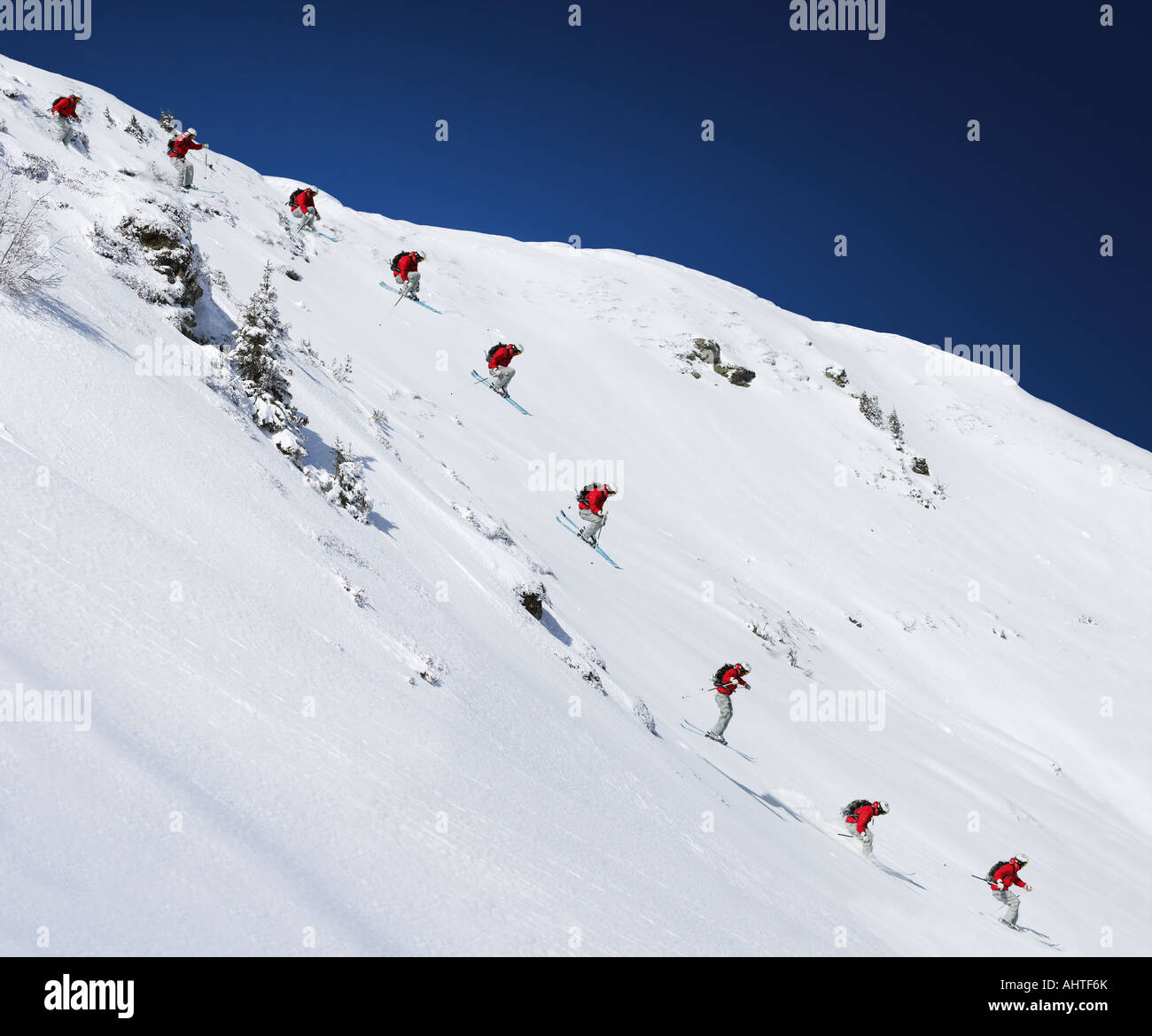 Sequence of male skier jumping down steep slope (Digital Composite ...