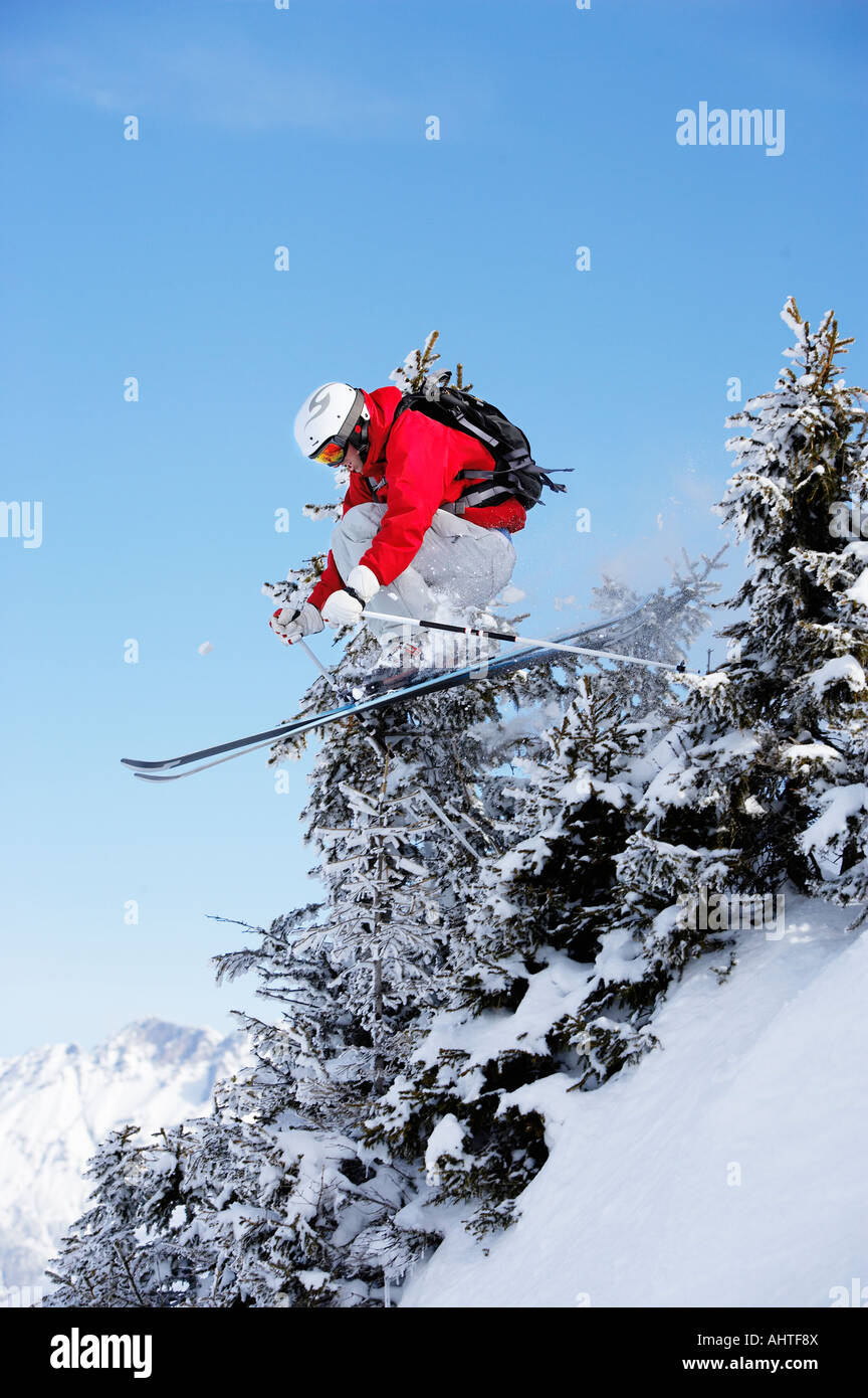 Male skier jumping through trees on slope hi-res stock photography and ...