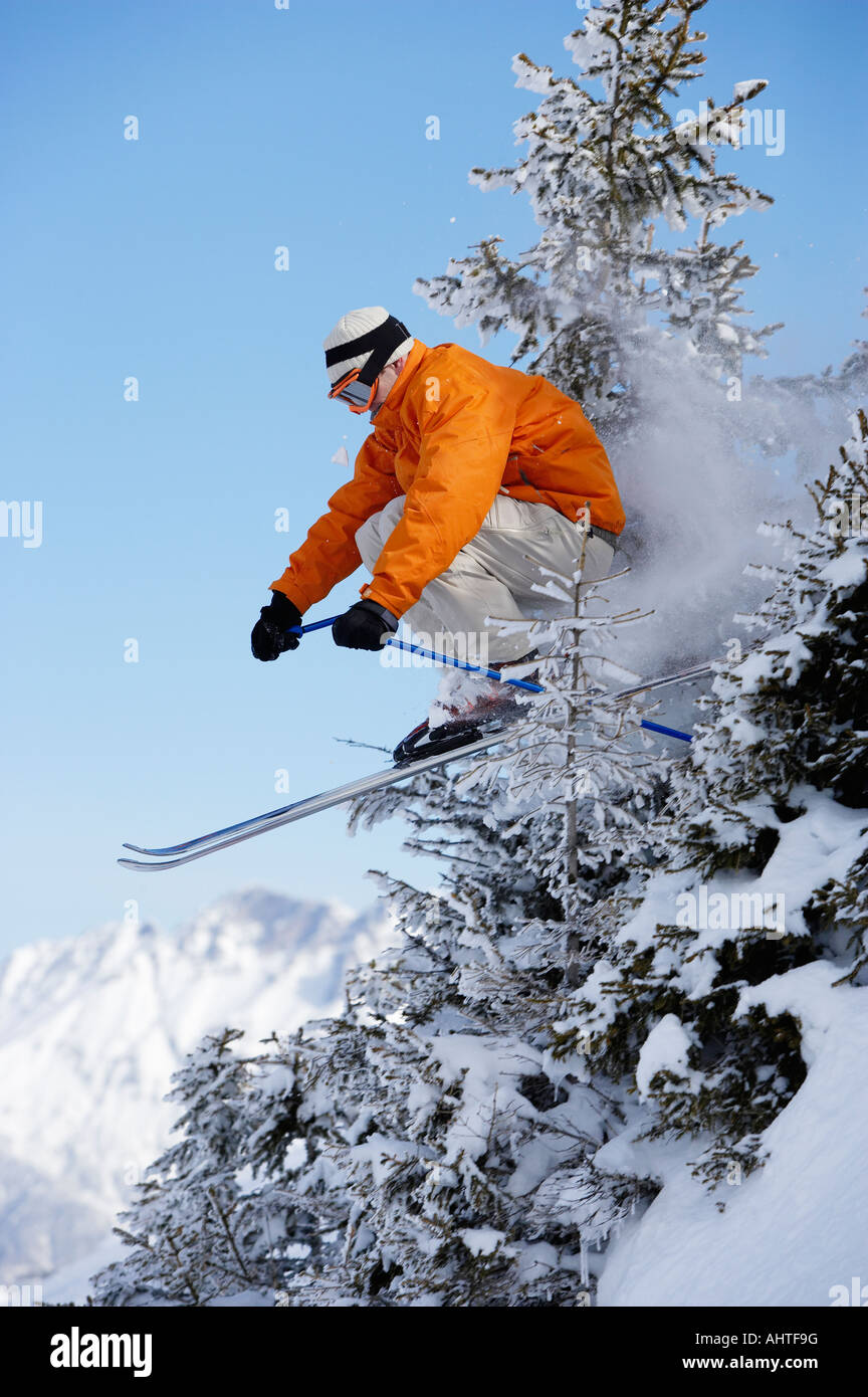 Male skier jumping through trees on slope hi-res stock photography and ...