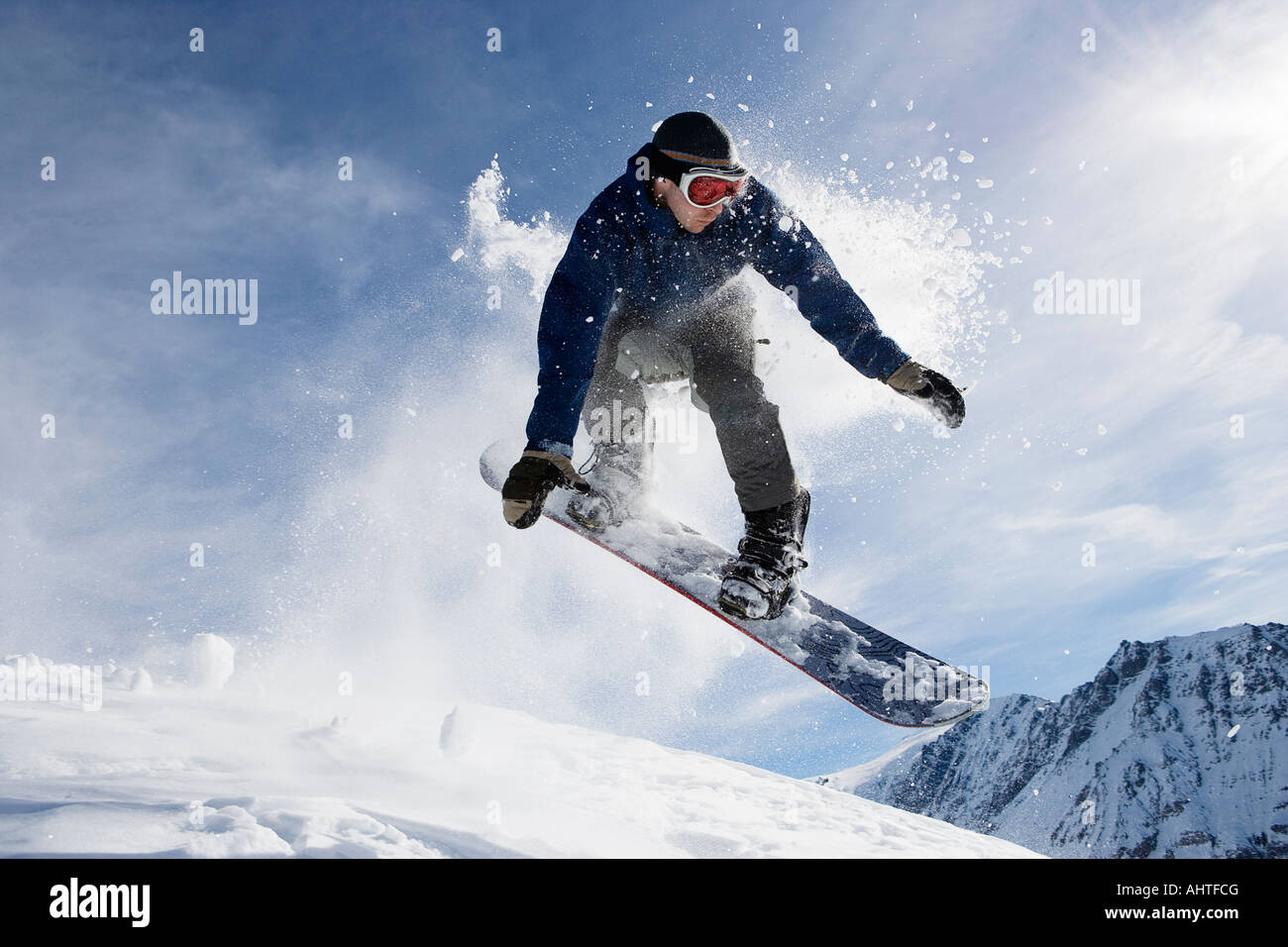 Male snowboarding on mountain, action shot Stock Photo - Alamy