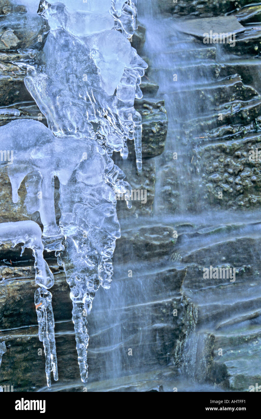 Water and ice on a rock wall Stock Photo - Alamy