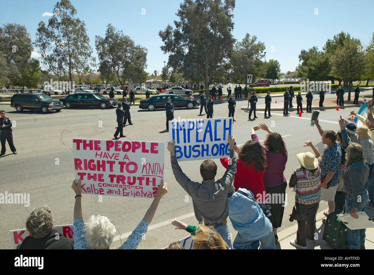 Presidential Motorcade with President George W Bush past anti Bush ...