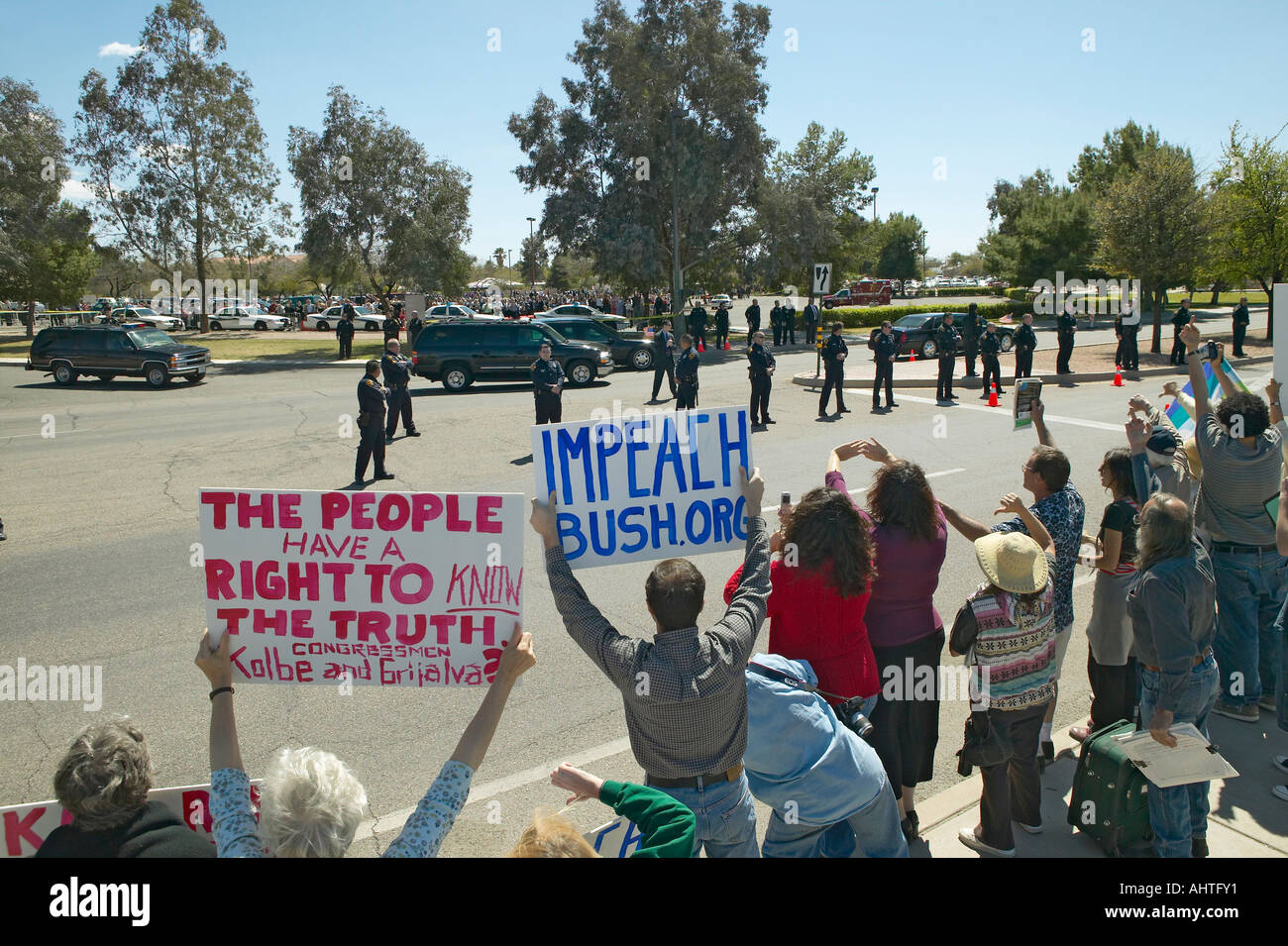 Presidential Motorcade with President George W Bush past anti Bush ...