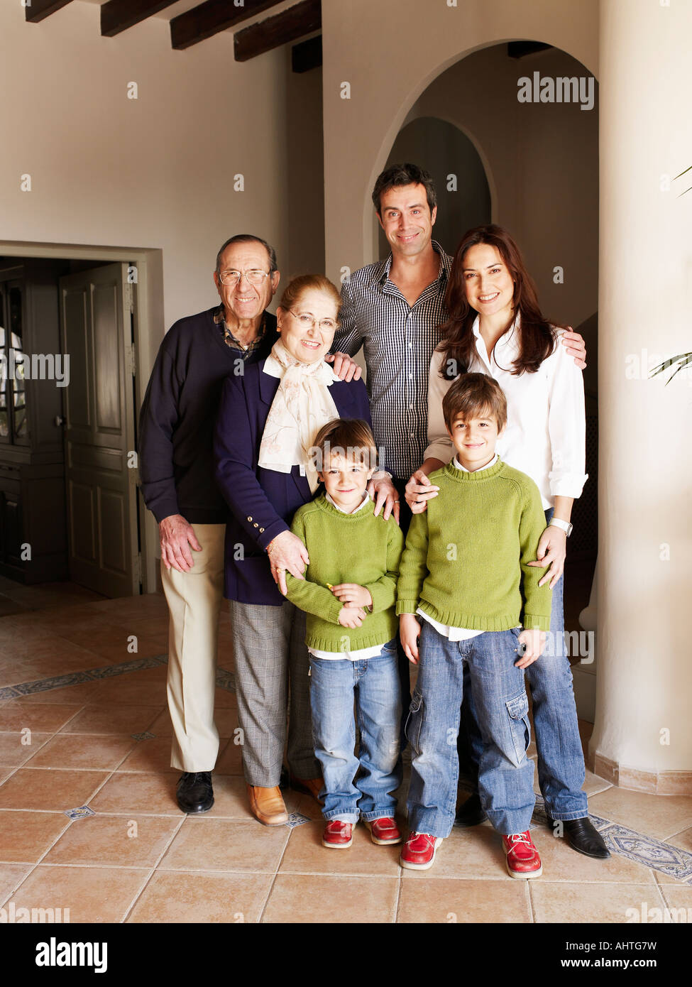 Three generation family standing in hall hi-res stock photography and ...