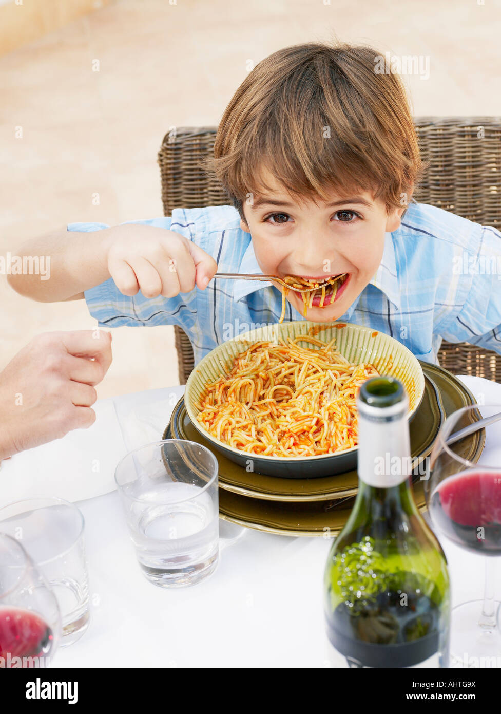 Boy (4-6) eating spaghetti, smiling, portrait Stock Photo - Alamy