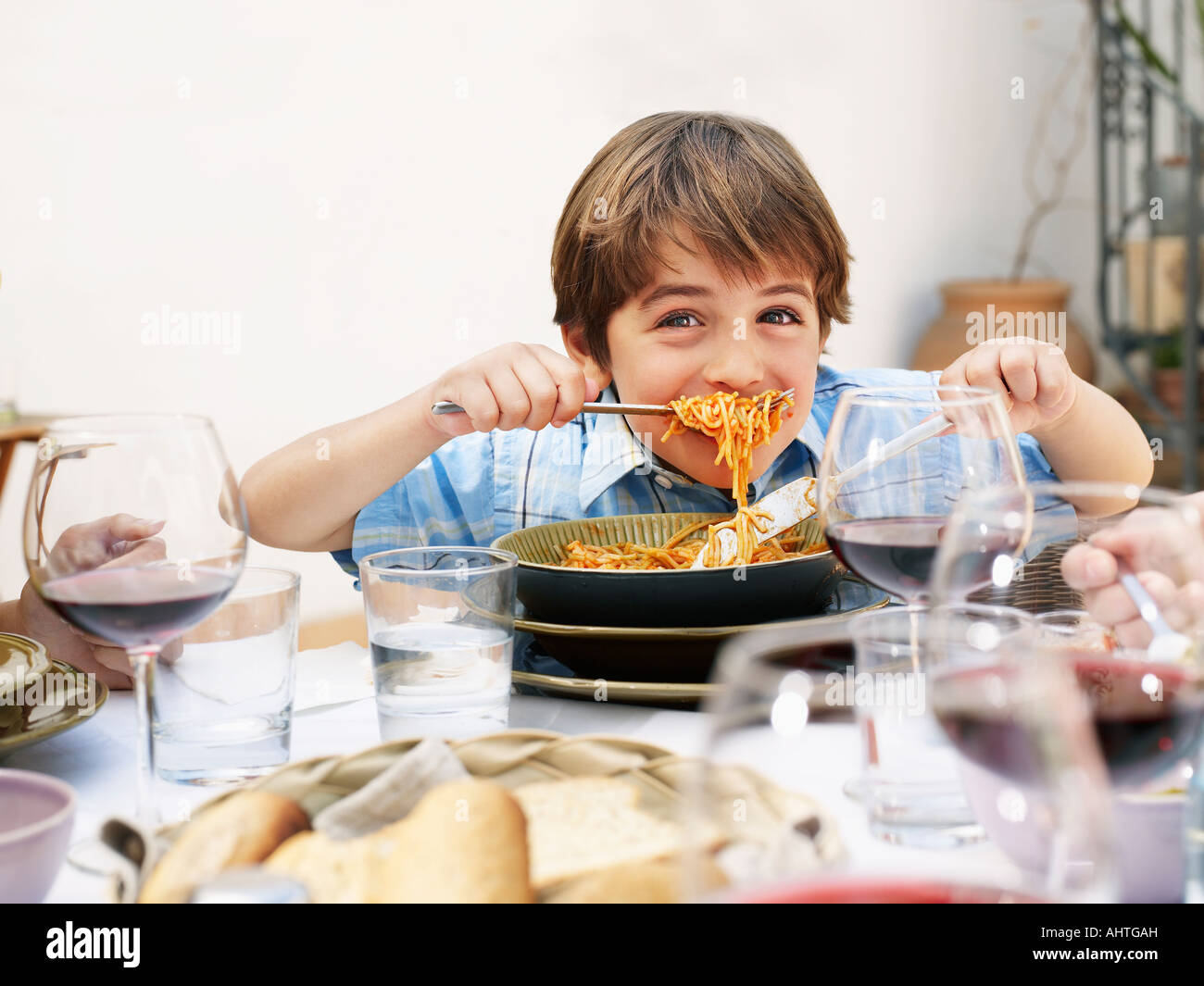 Boy (4-6) eating spaghetti, smiling, portrait Stock Photo - Alamy