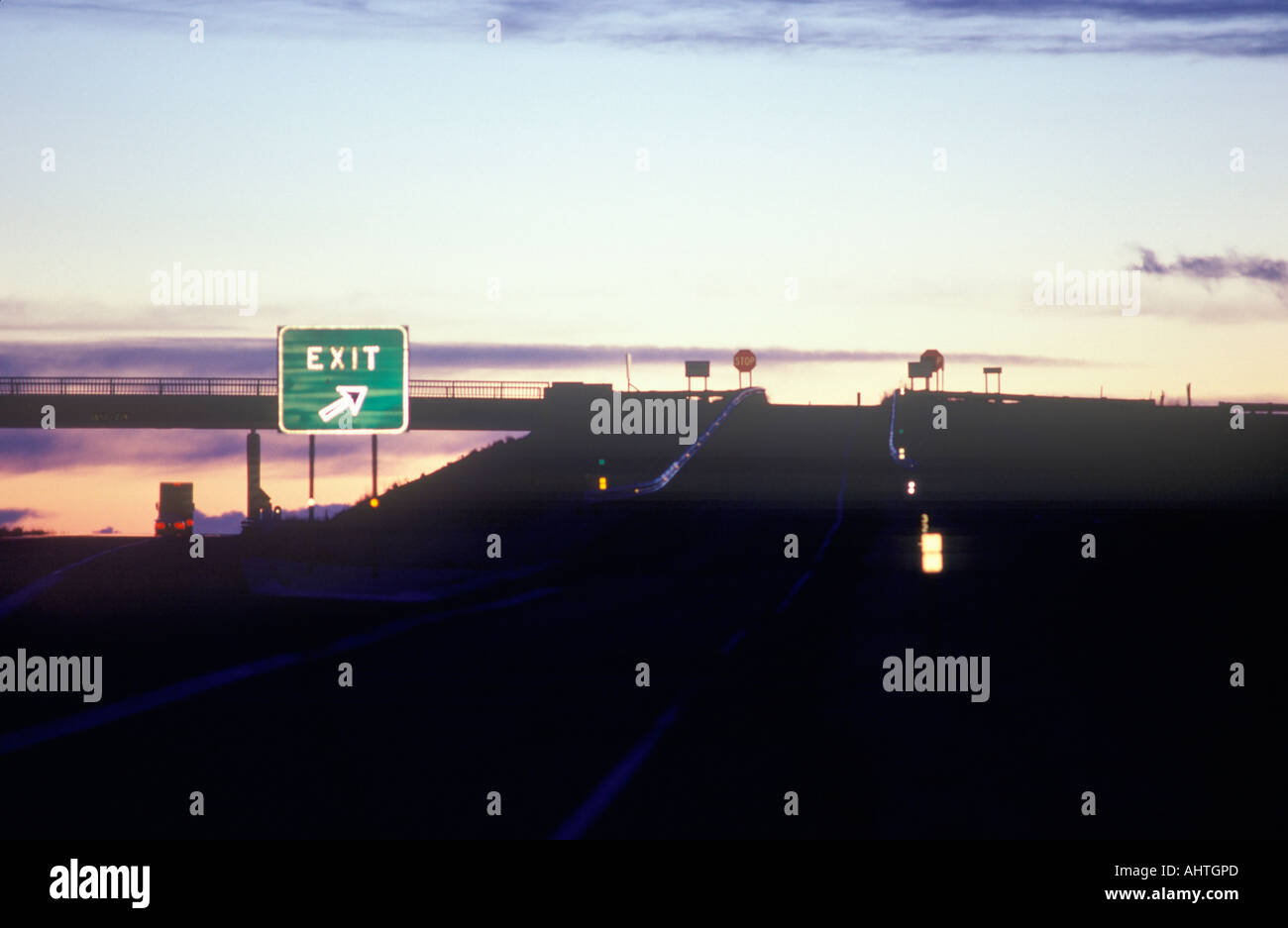 A freeway exit sign at dusk Stock Photo - Alamy