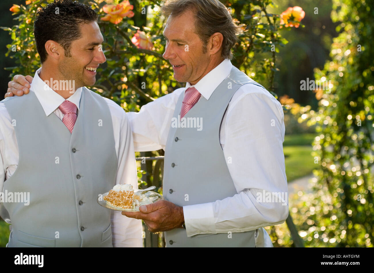 Mature father and groom talking in garden, smiling Stock Photo - Alamy