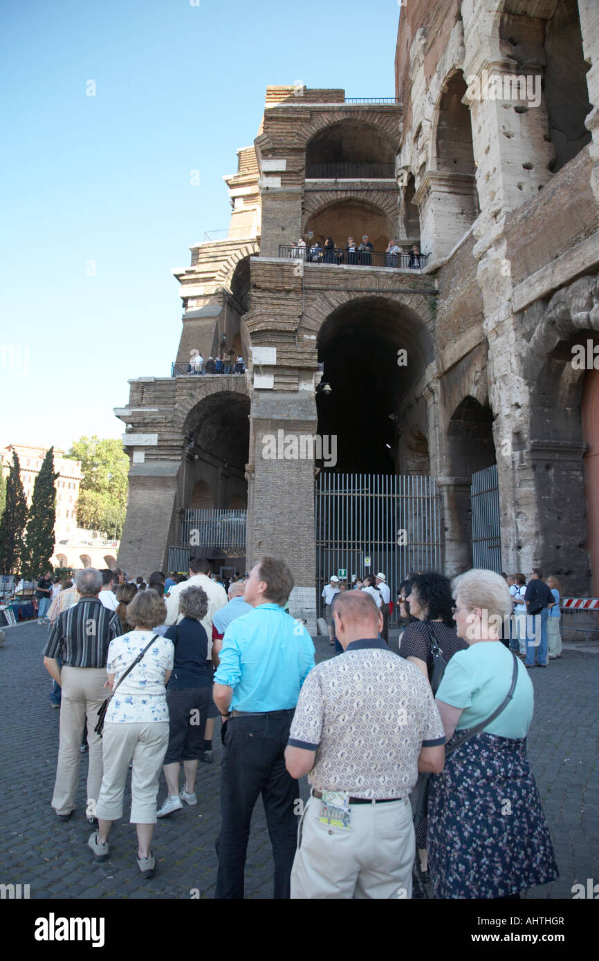 the mid morning queue of tourists queuing around the side of the ...