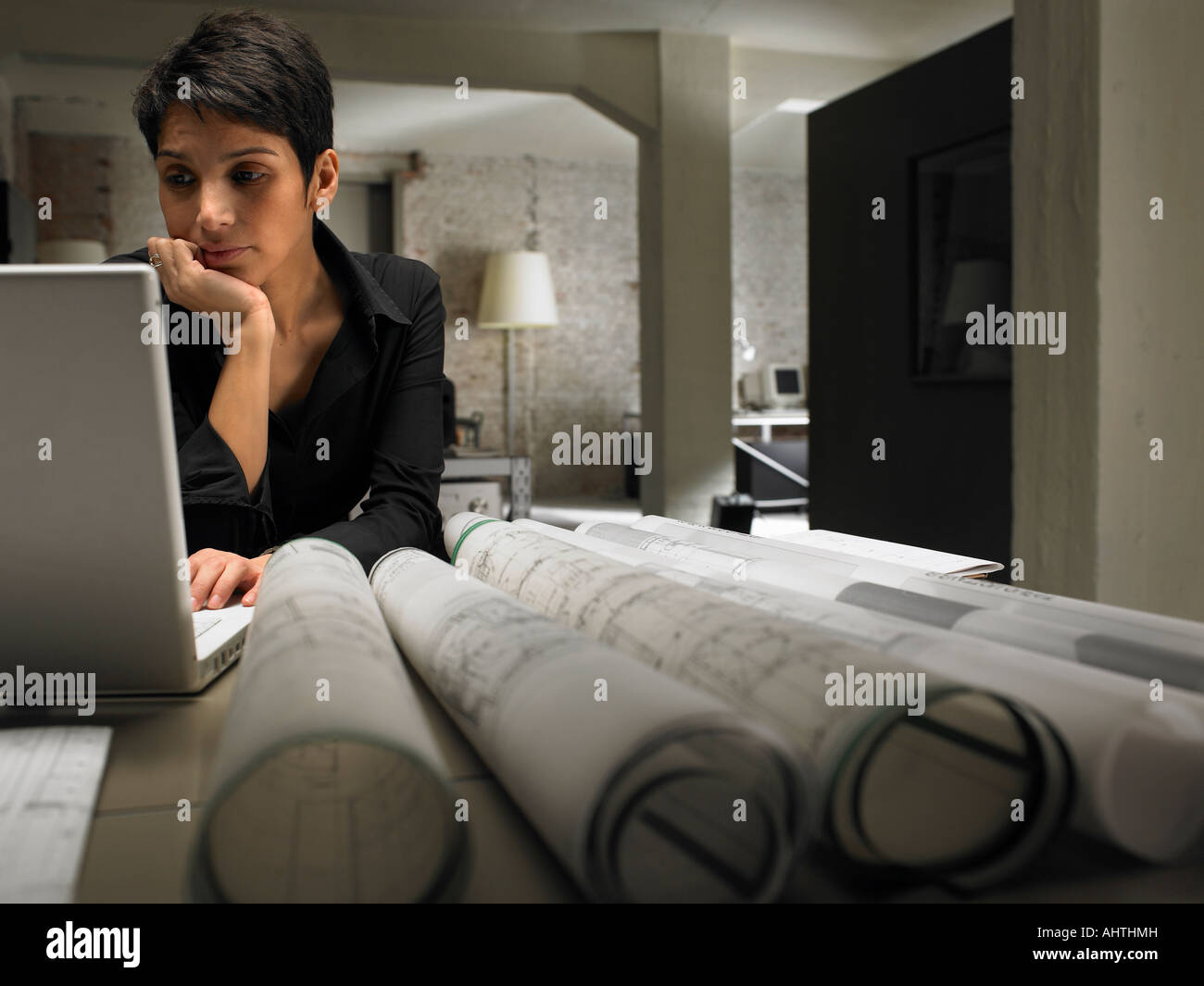 Laptop computers desk open plan office hi-res stock photography and ...