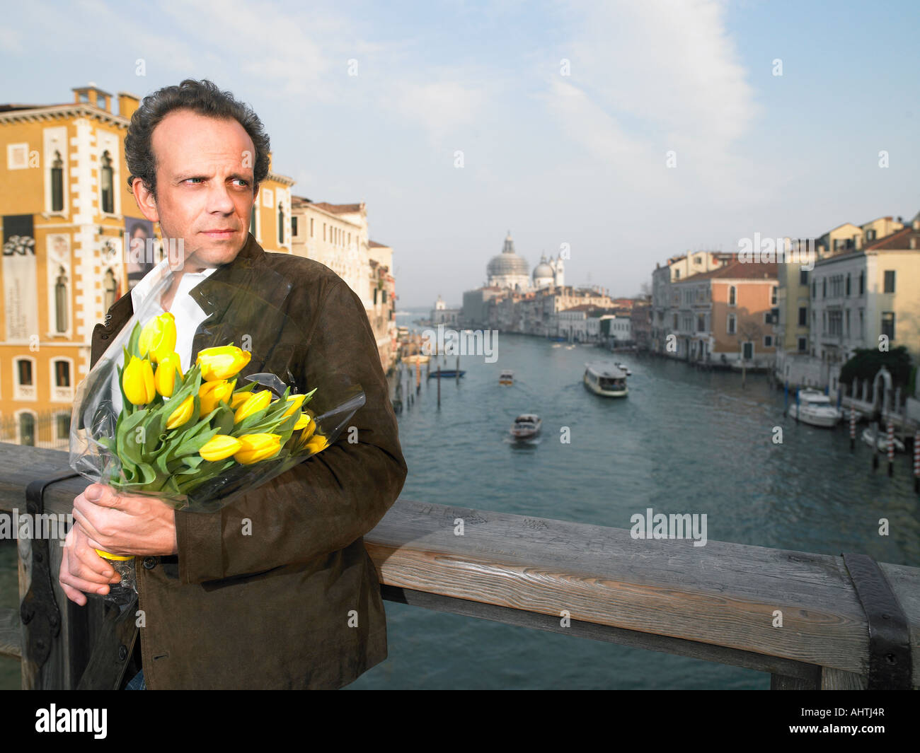 Man waiting on bridge holding flowers hi-res stock photography and ...
