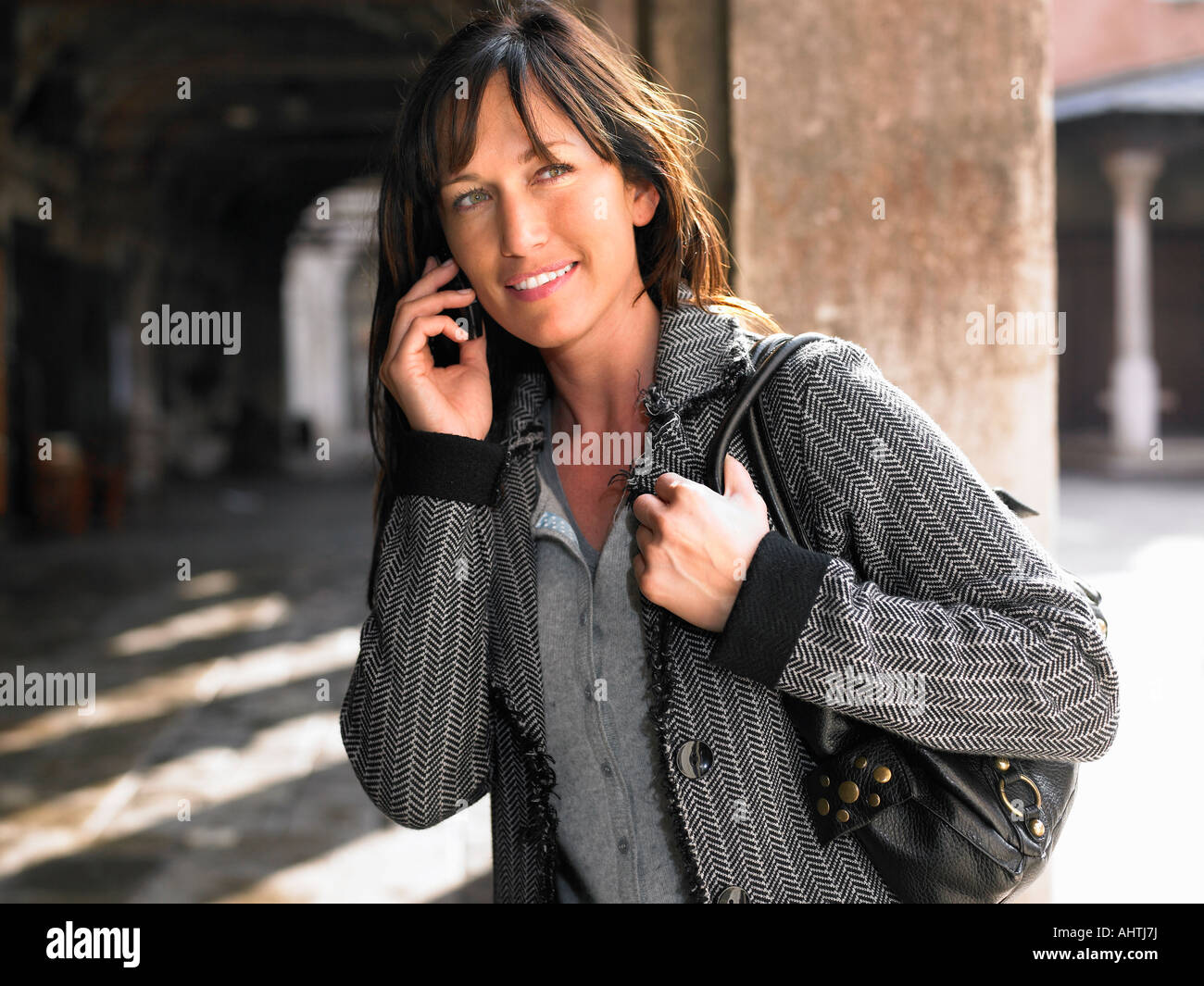 Woman talking on mobile phone. Venice, Italy Stock Photo - Alamy