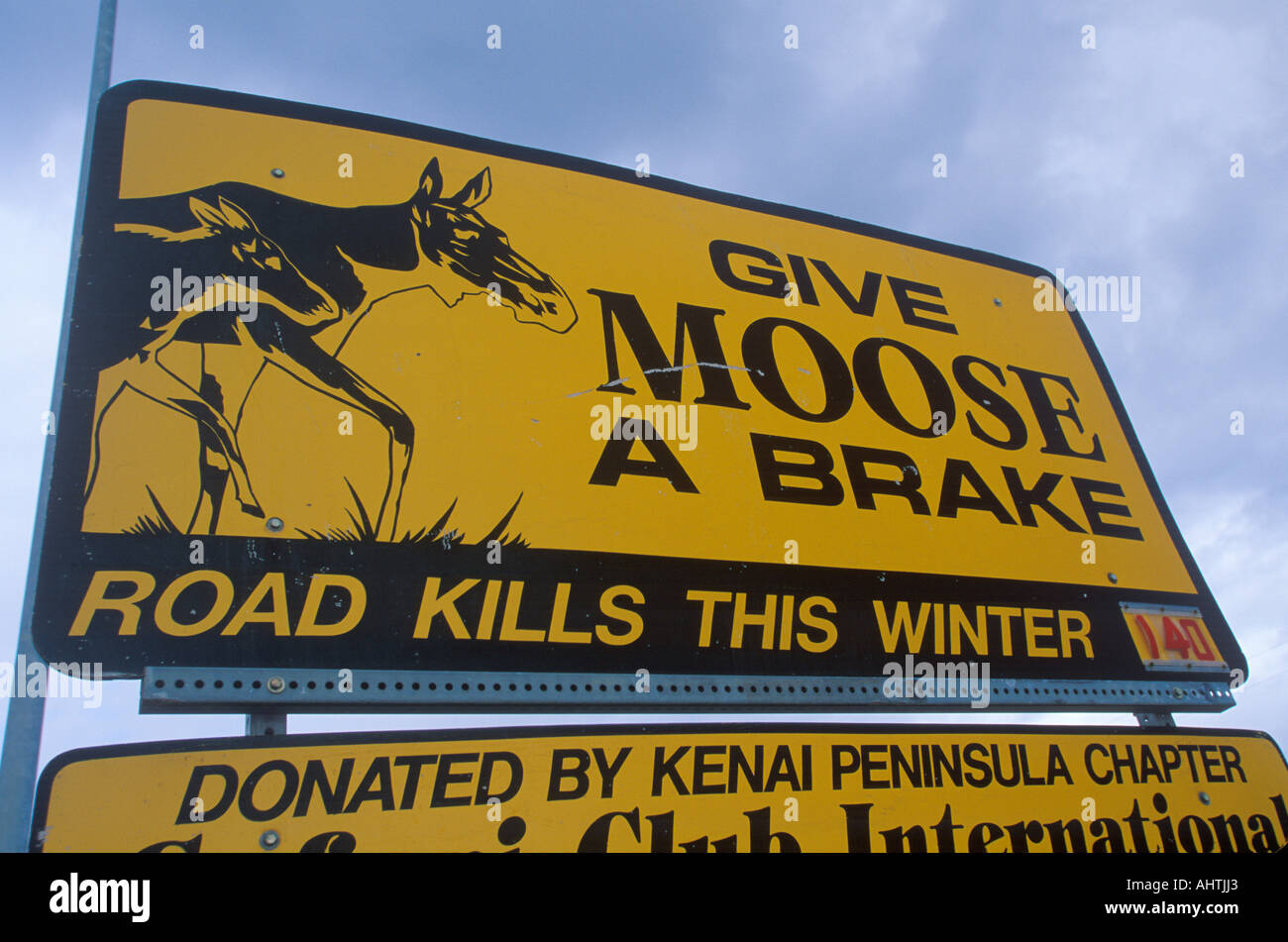 A sign that reads Give moose a brake Stock Photo - Alamy