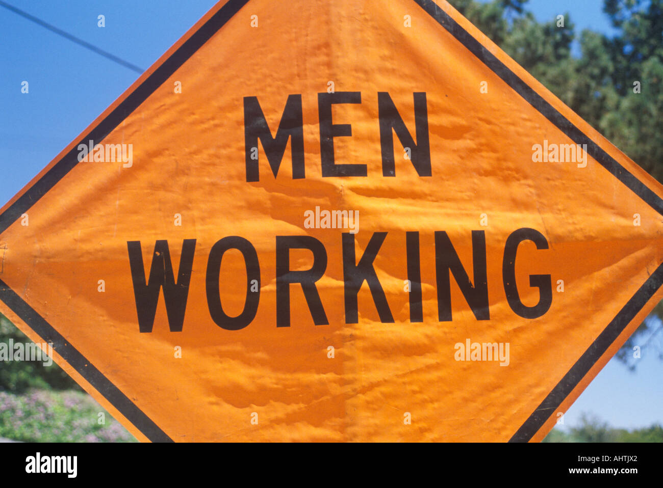 Men working road sign hi-res stock photography and images - Alamy