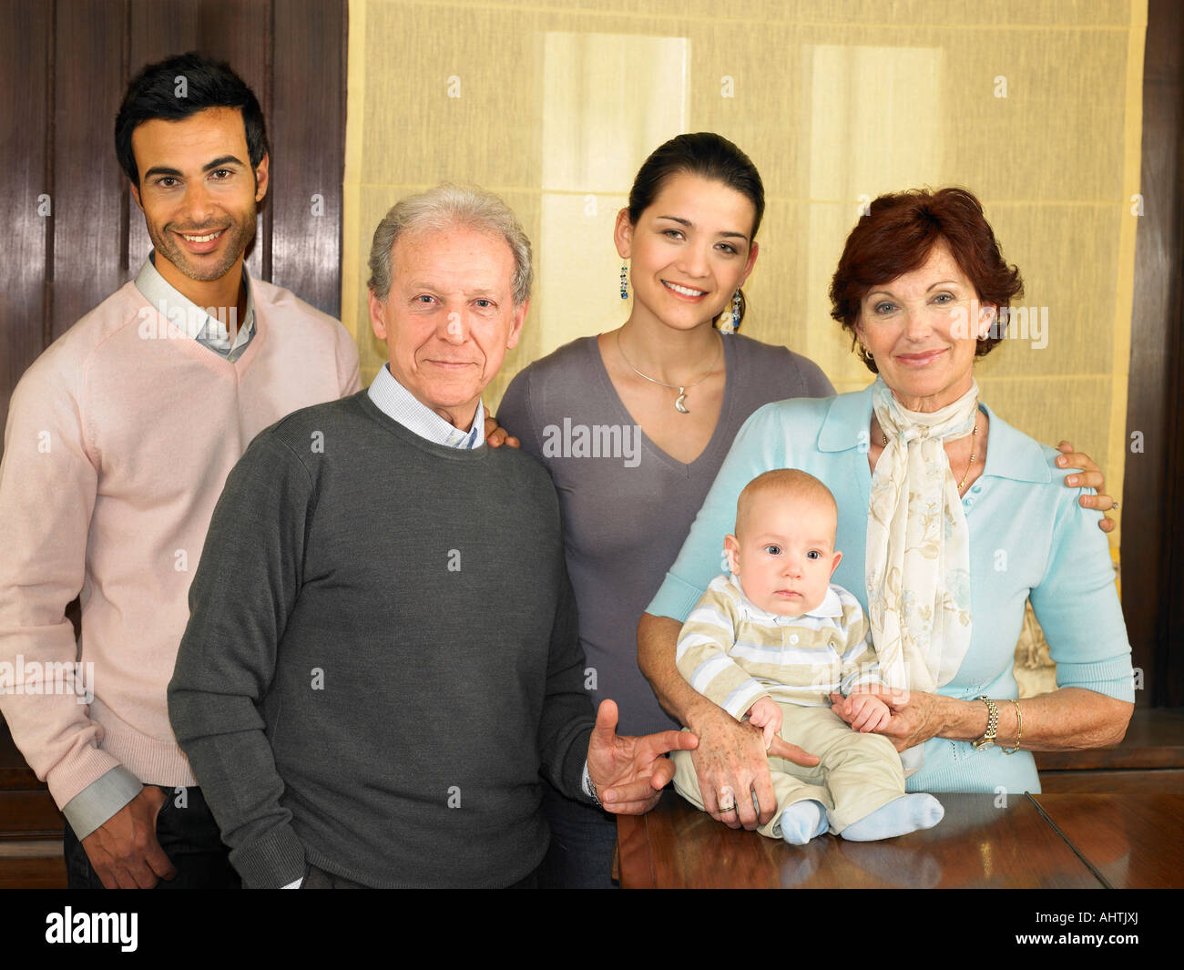 Multigenerational family (grandparents, parents and baby boy(7months ...