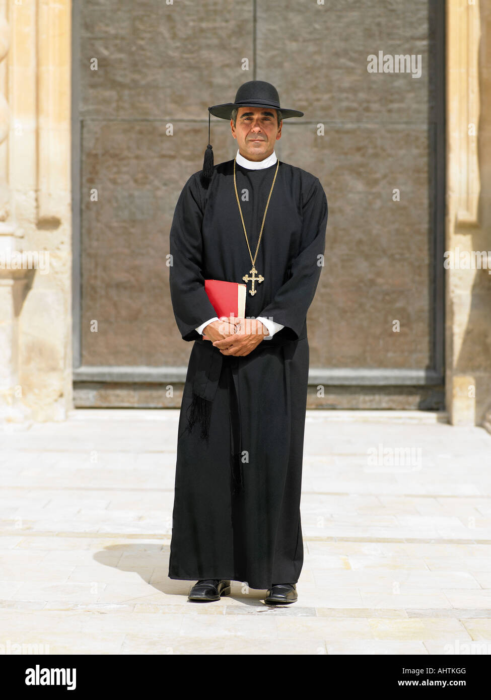 Full length portrait of priest by ornate door, Alicante, Spain Stock ...