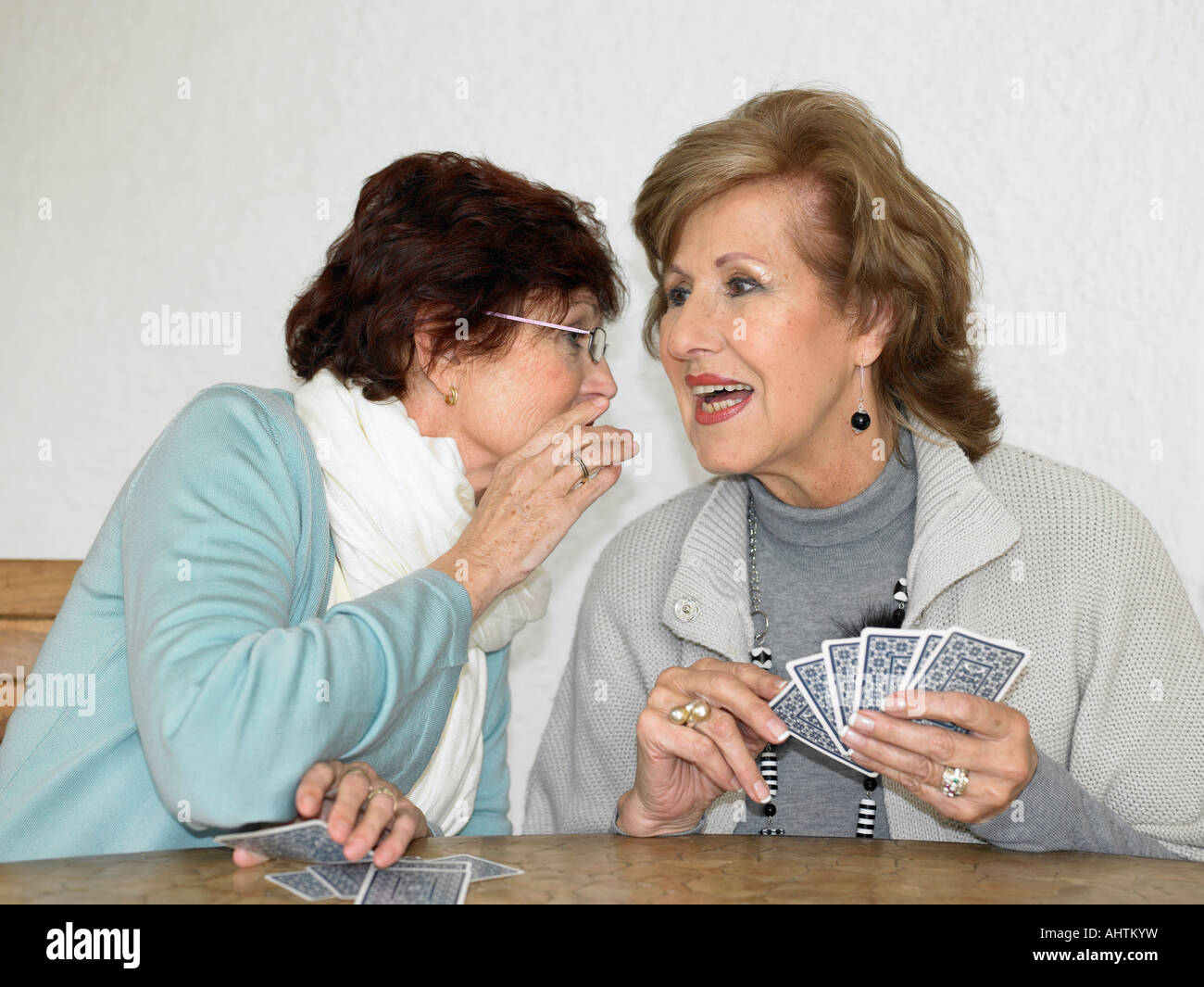 Woman leisurely playing cards on hi-res stock photography and images ...