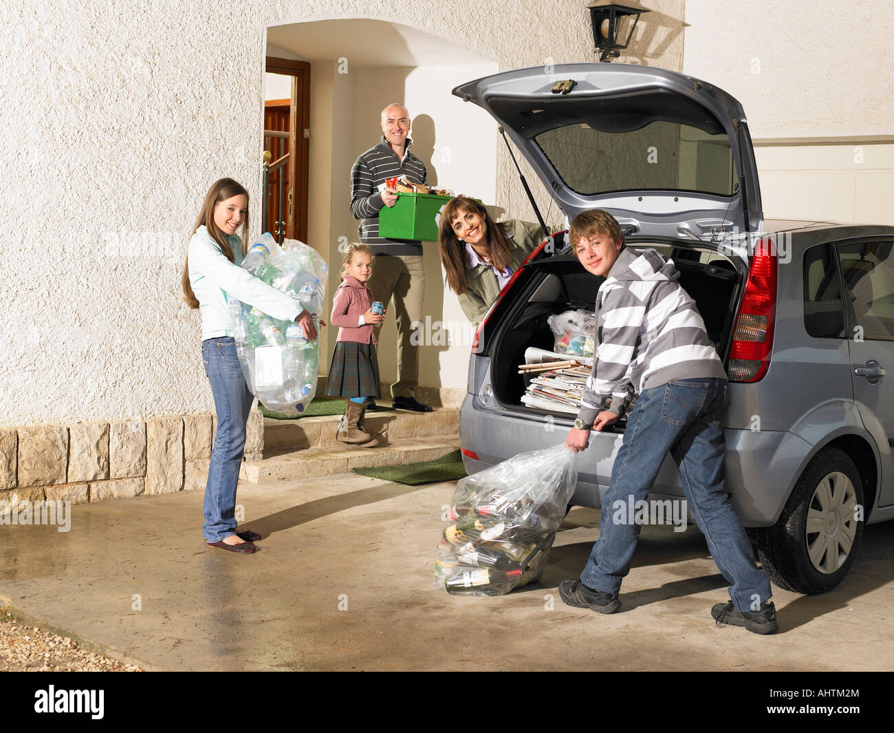 Family loading car boot with recycling hi-res stock photography and ...