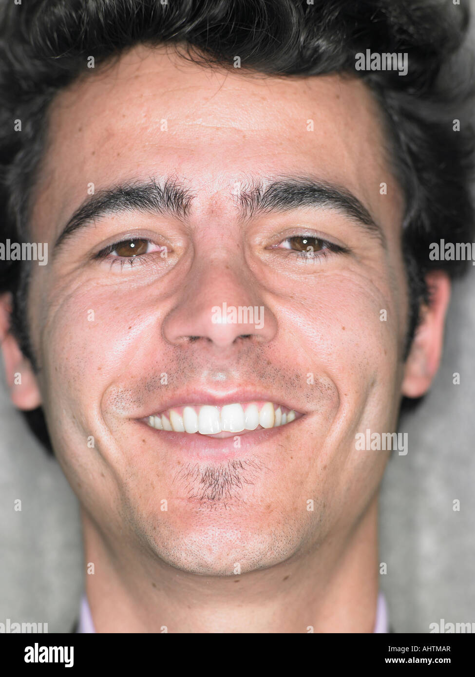 Close up portrait of young man smiling, Alicante, Spain Stock Photo - Alamy