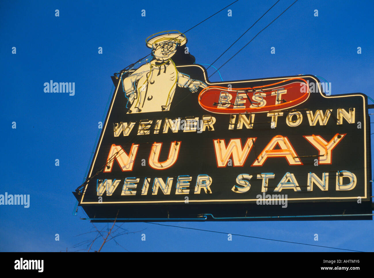 A neon sign that reads Best Weiner in Town Nu Way Weiner Stand Stock ...