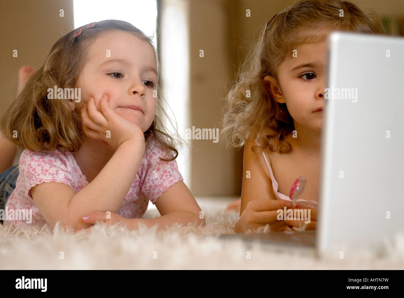 Two girls (2-4) using laptop Stock Photo - Alamy