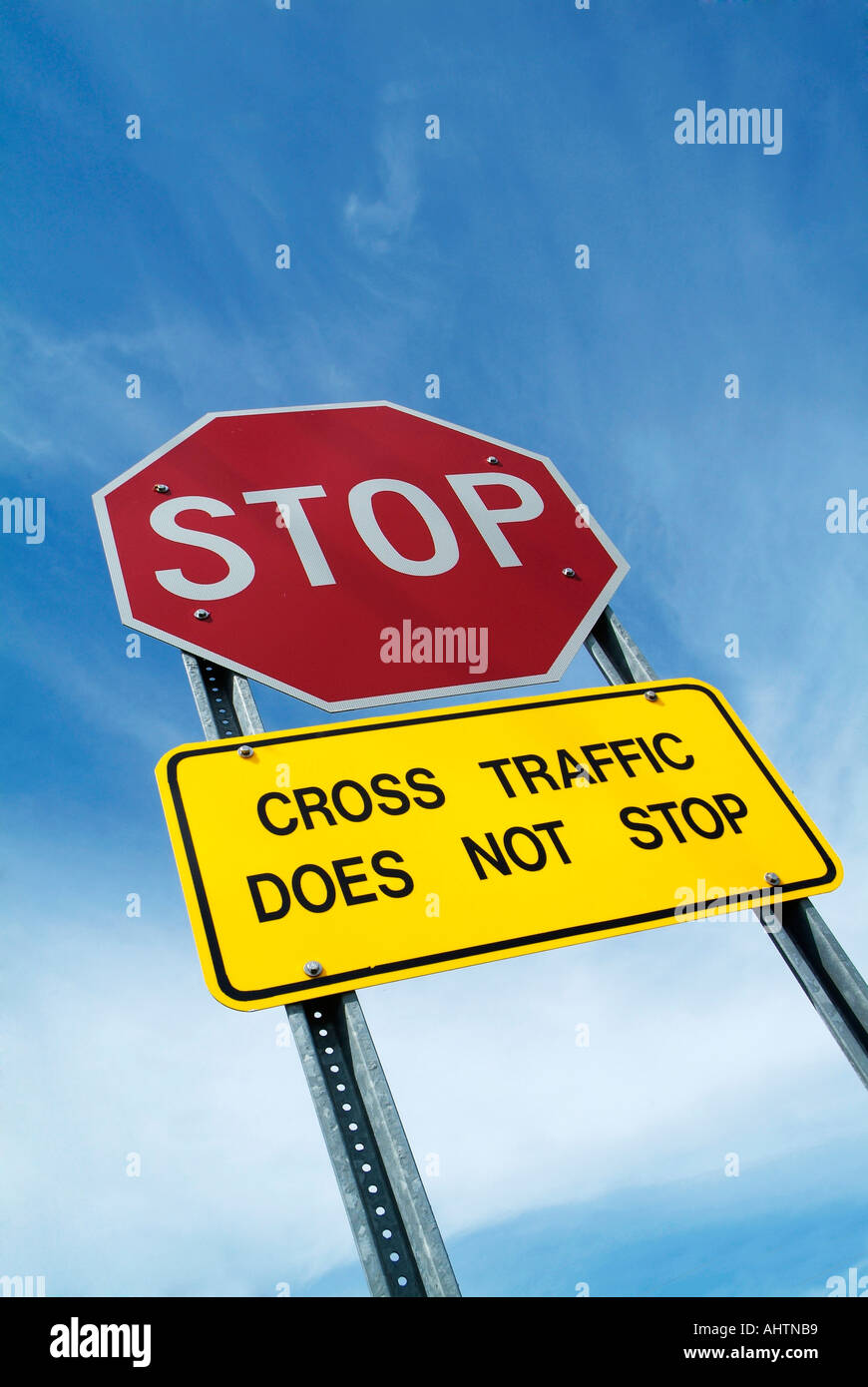 Stop sign warn that crossing traffic does not stop Stock Photo - Alamy