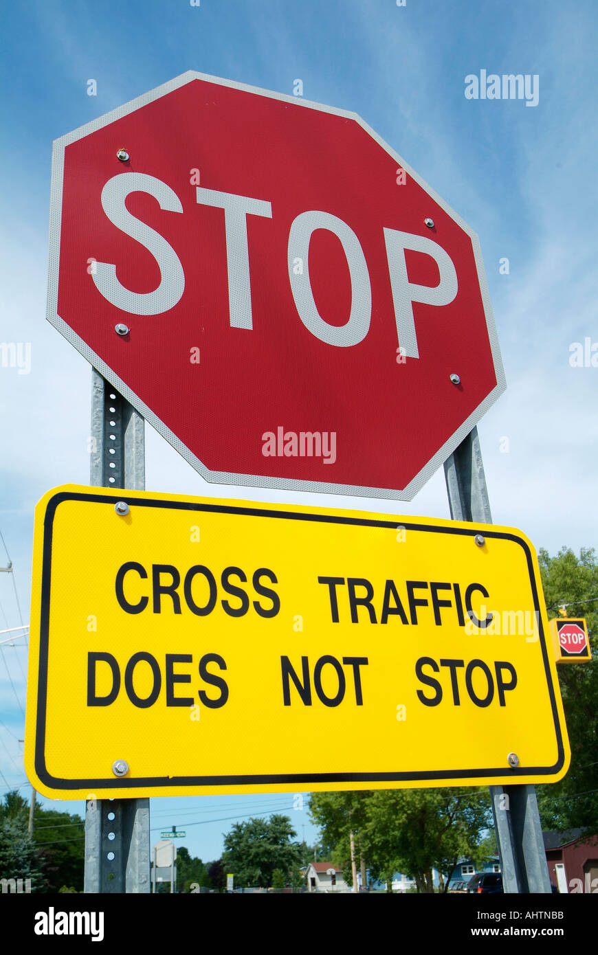 Stop sign warn that crossing traffic does not stop Stock Photo - Alamy