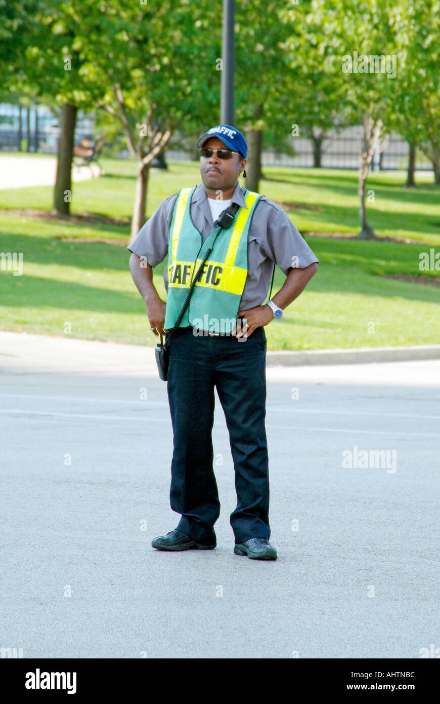 Traffic police direct pedestrian and automobile traffic in busy ...