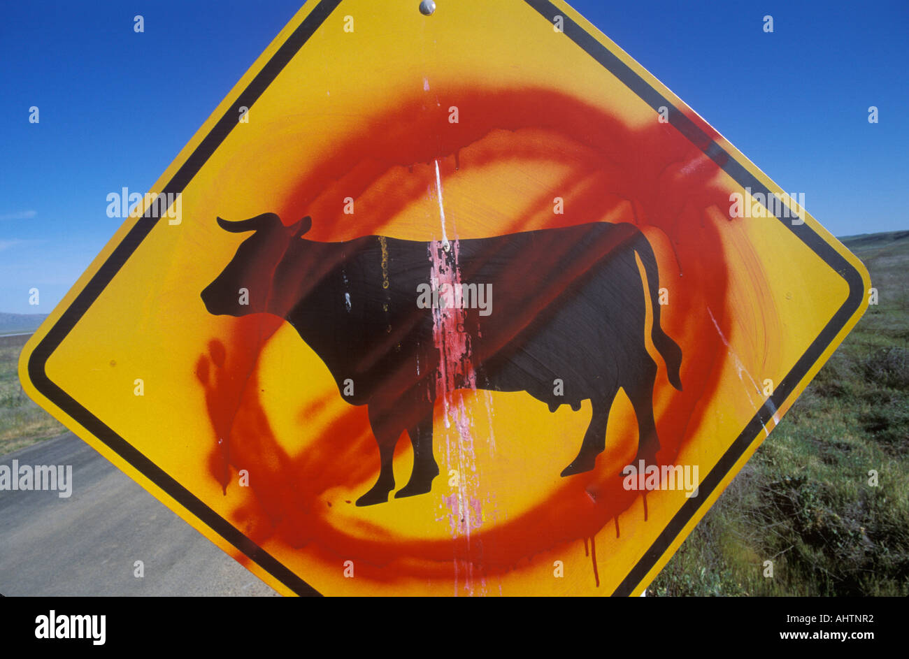 A defaced roadside sign Stock Photo - Alamy