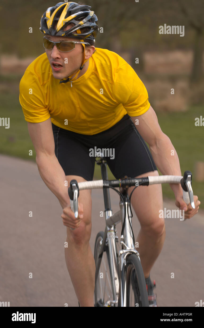 Man cycling in park Stock Photo - Alamy