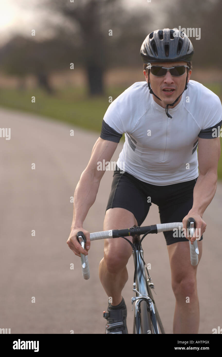 Man cycling in park Stock Photo - Alamy