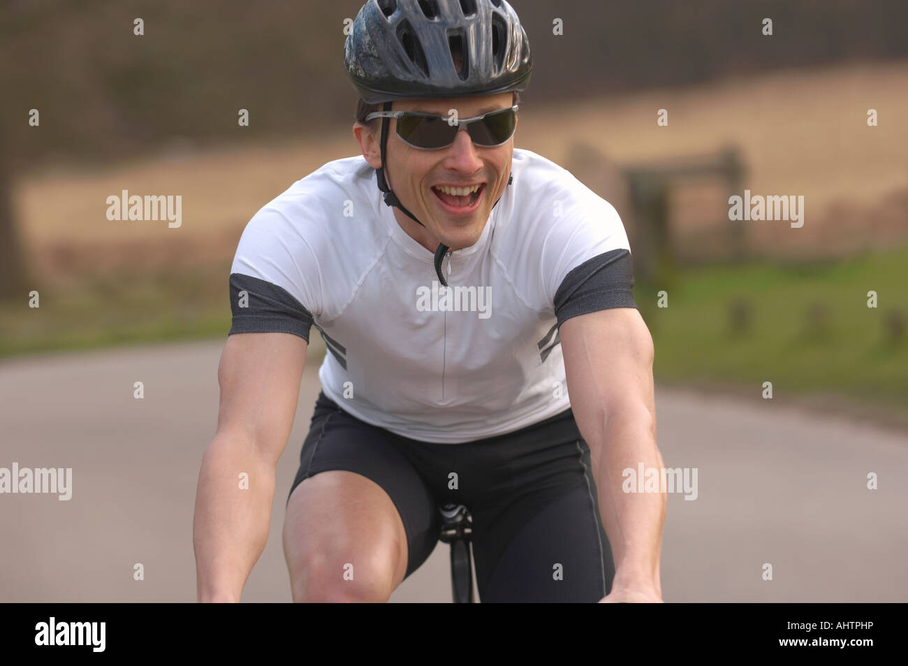 Man cycling in park Stock Photo - Alamy