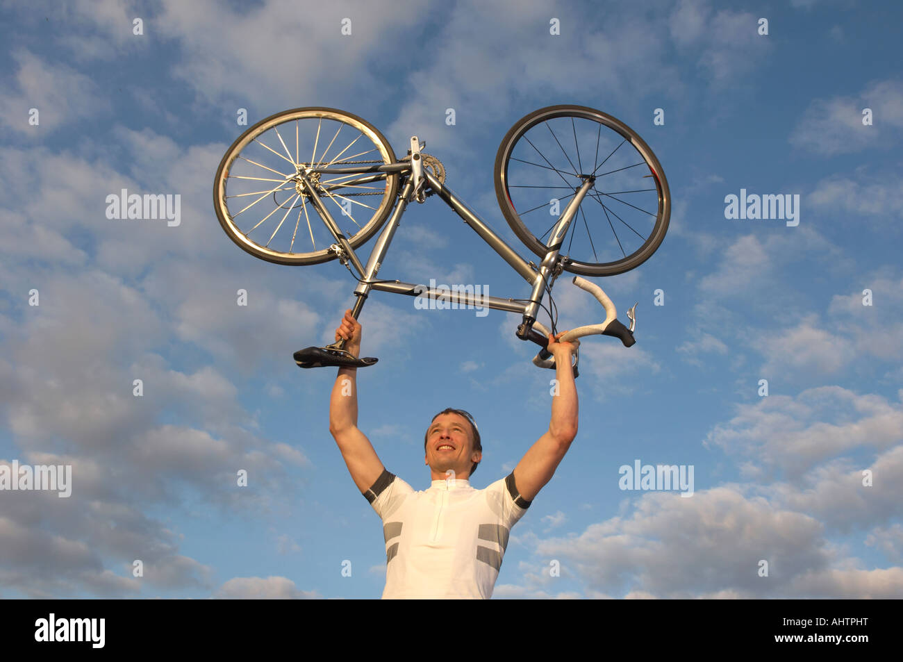 Man cycling in park Stock Photo - Alamy