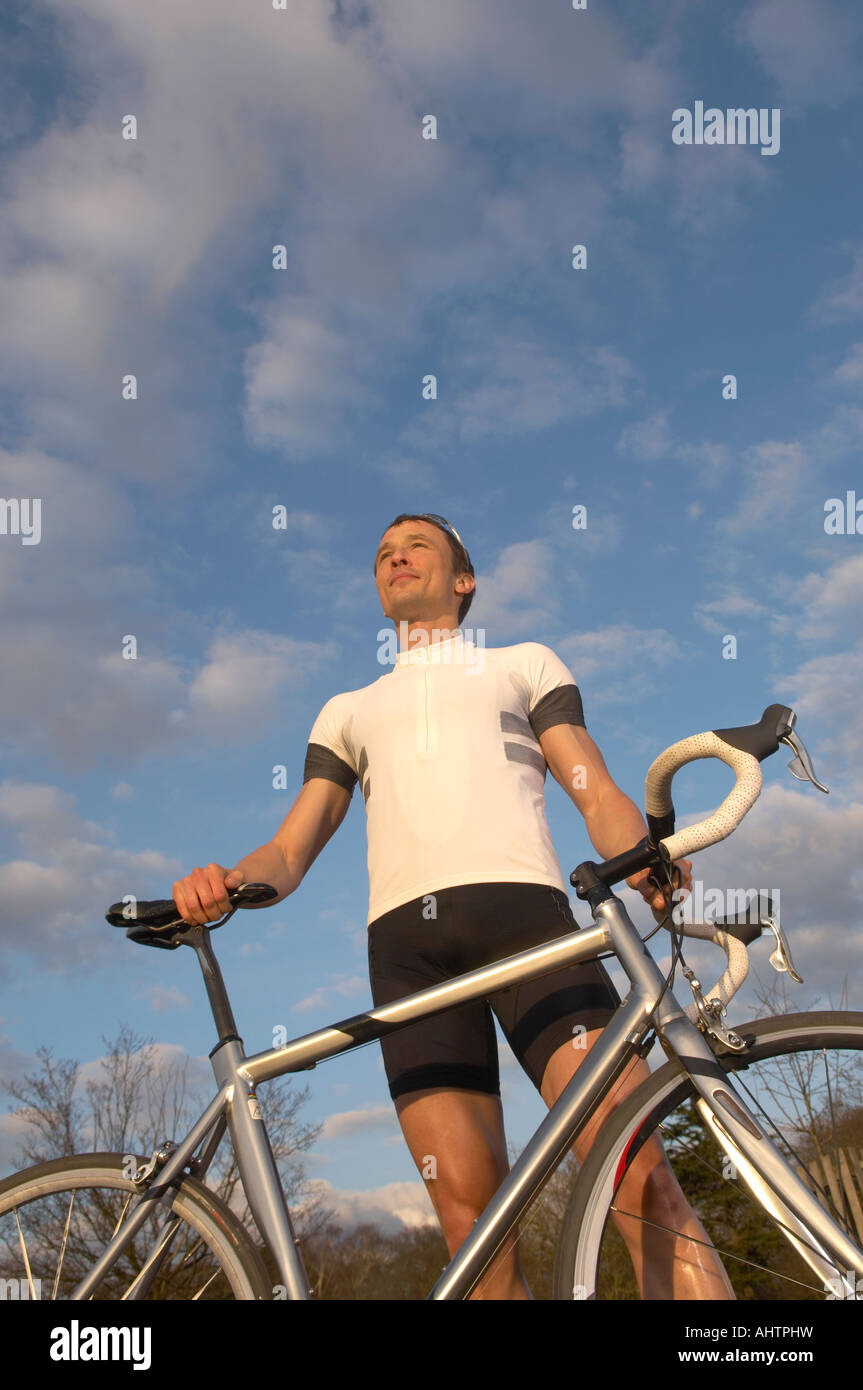 Man cycling in park Stock Photo - Alamy