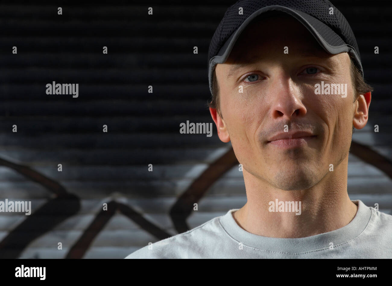 Man wearing cap, portrait, close-up Stock Photo - Alamy