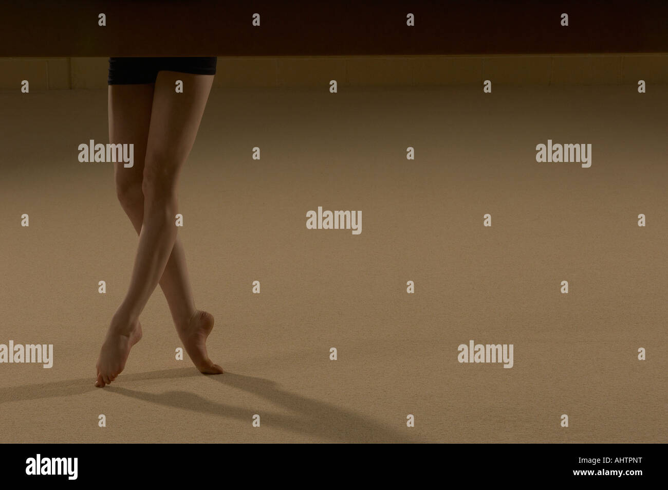 Teenage gymnast (16-18) balancing on toes, low section Stock Photo - Alamy